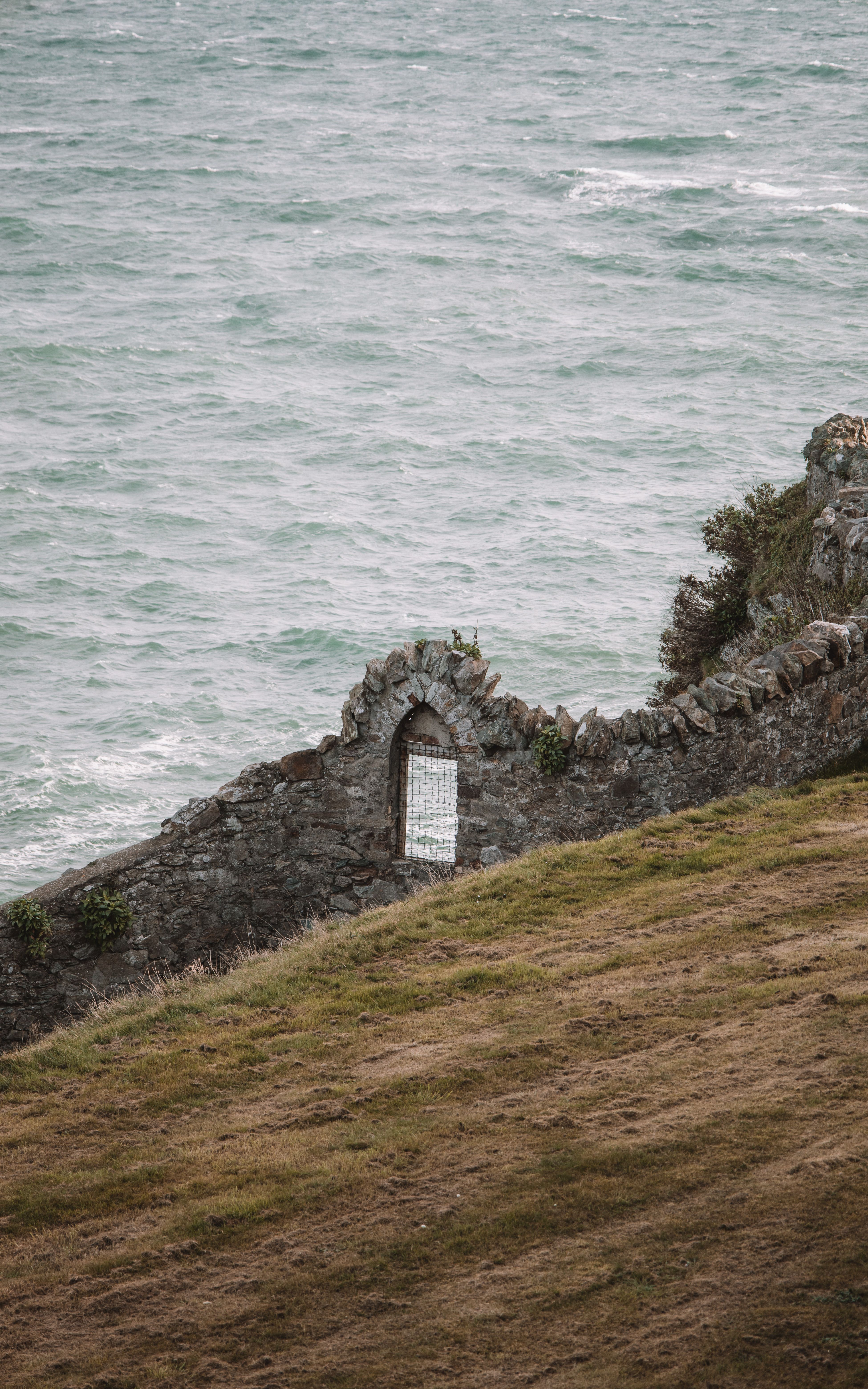 Stone Wall at Seashore on Sunset · Free Stock Photo