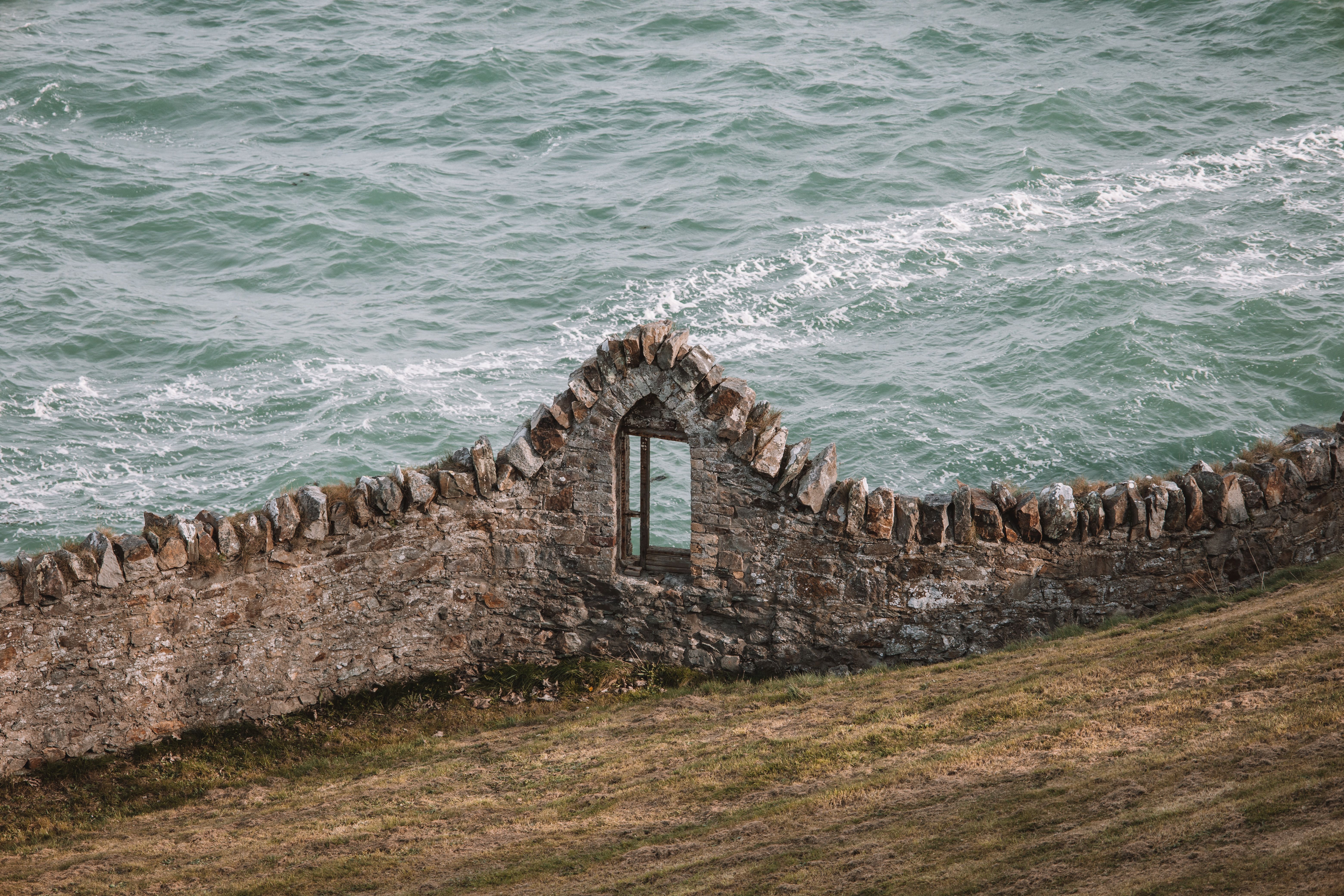 Old Stone Wall at Seashore near Water · Free Stock Photo