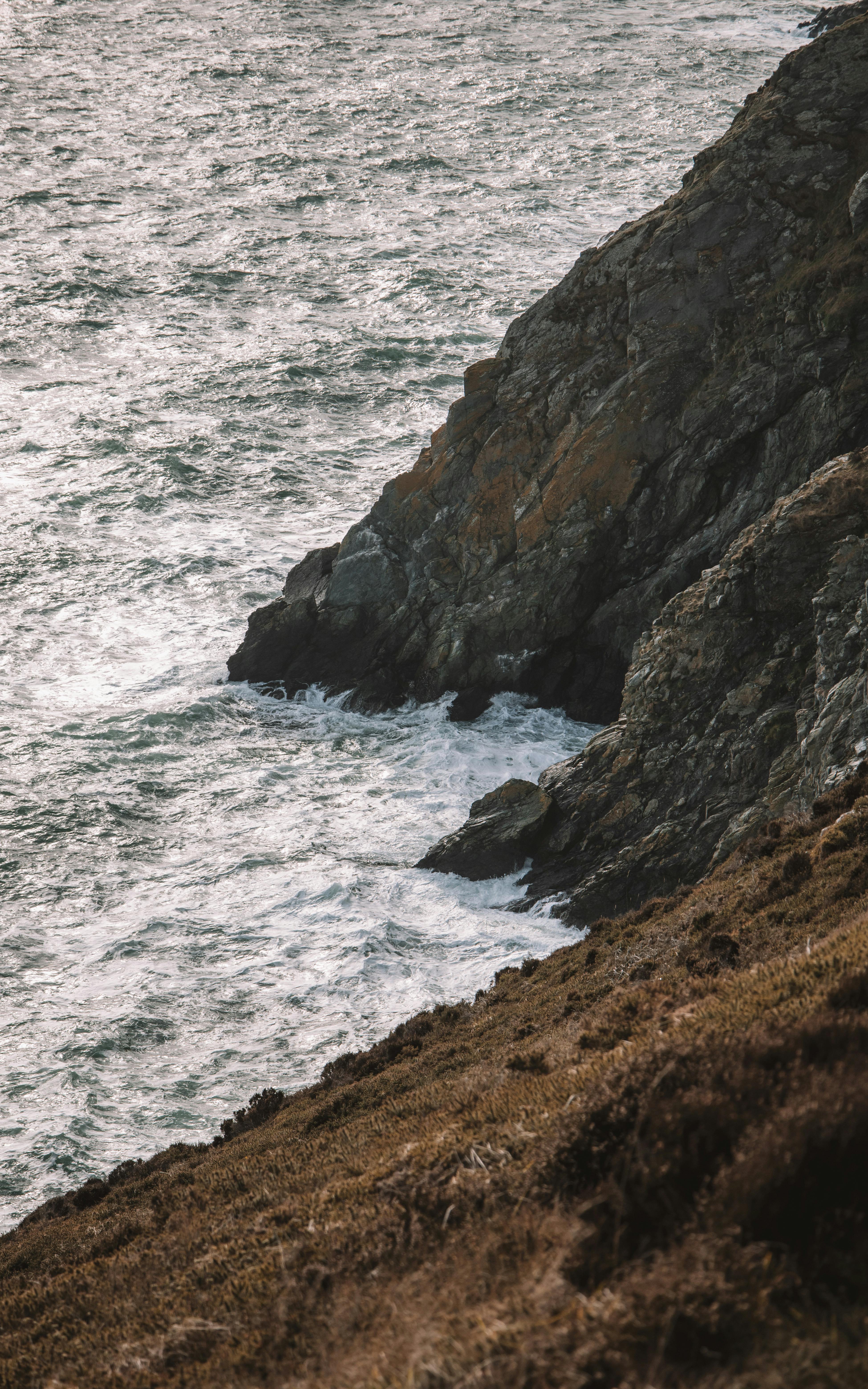 Cliff in Sea Water on Sunset · Free Stock Photo