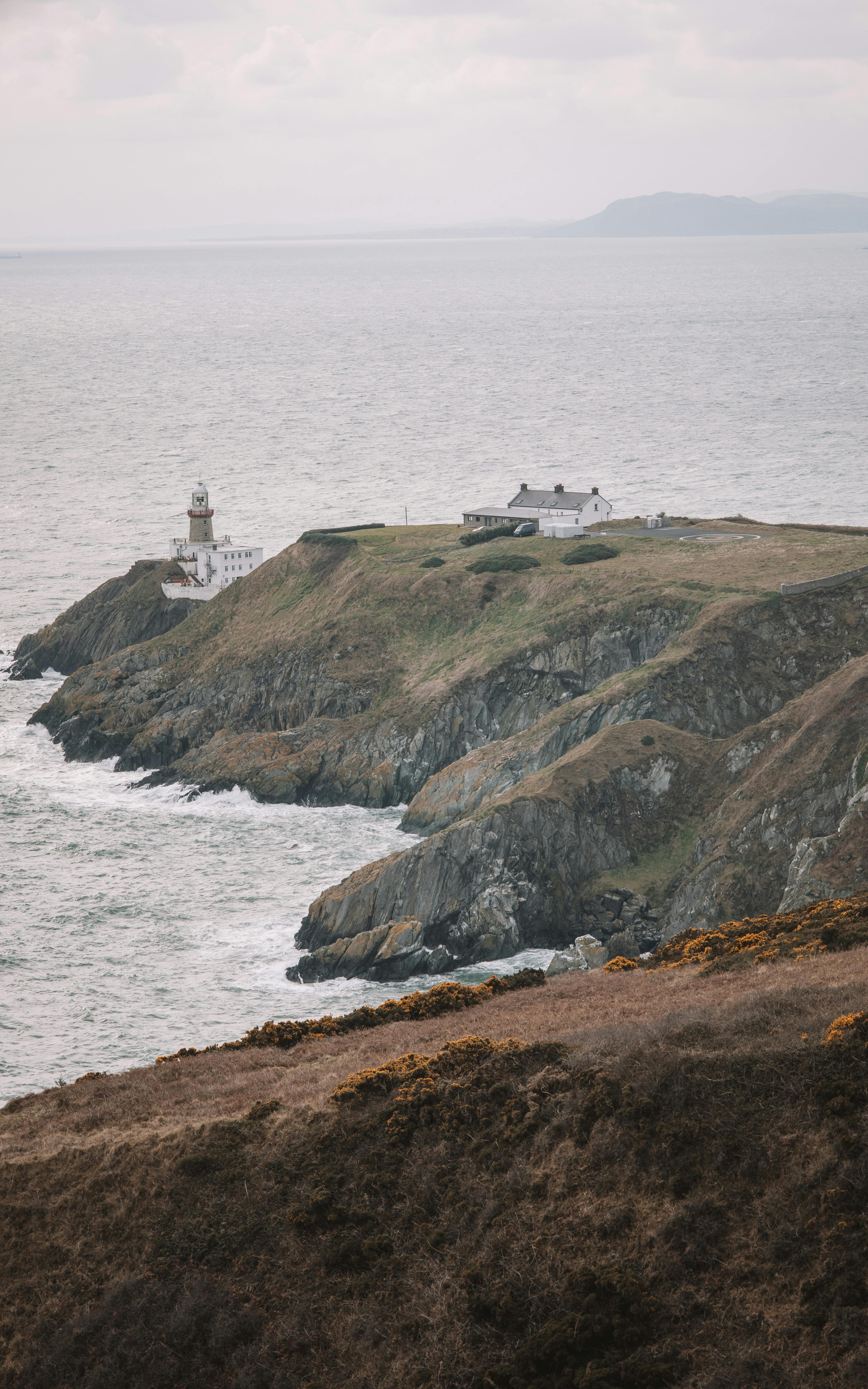 Lighthouse on Rock at Seashore · Free Stock Photo