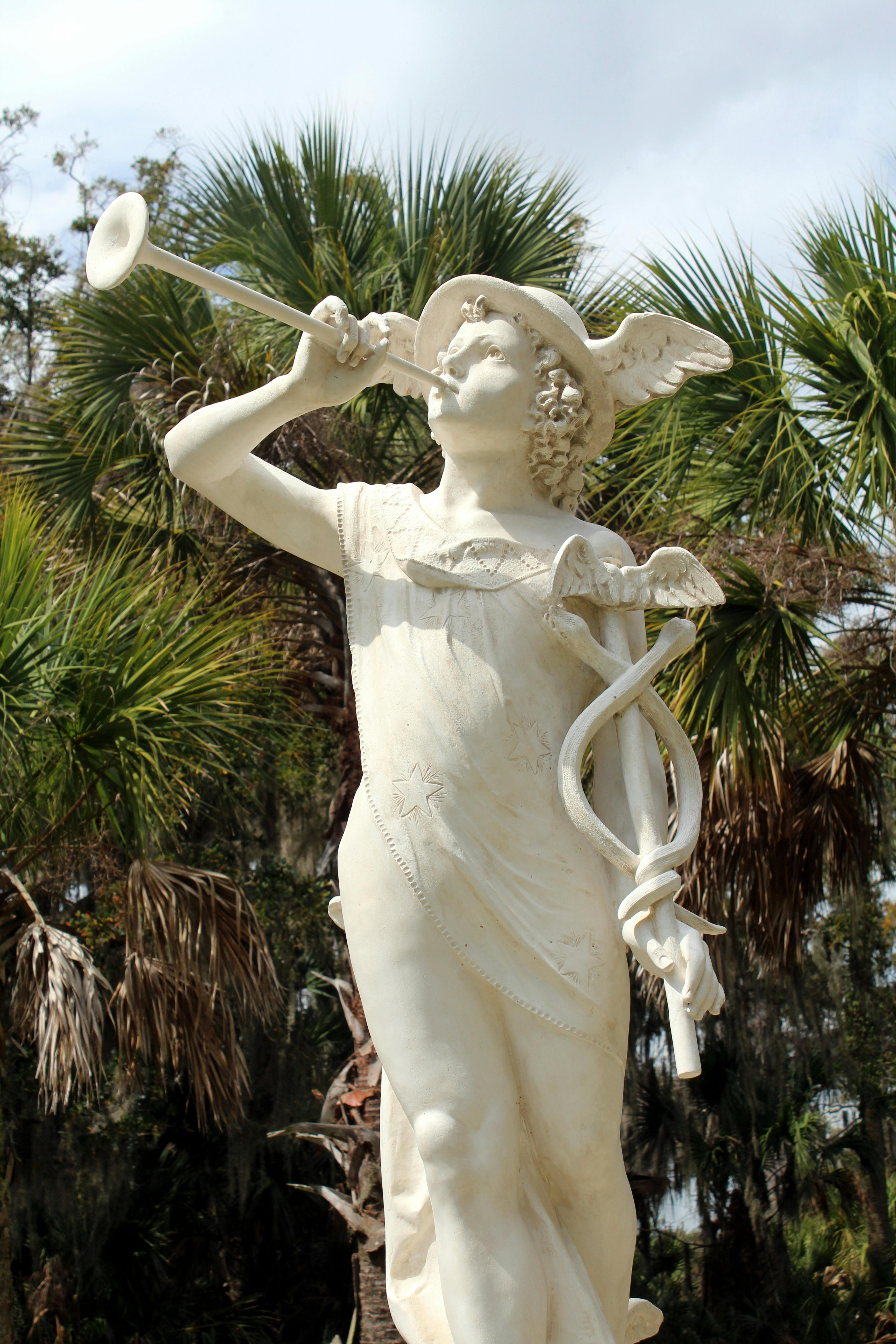 Photo Of A Statue Blowing Trumpet · Free Stock Photo