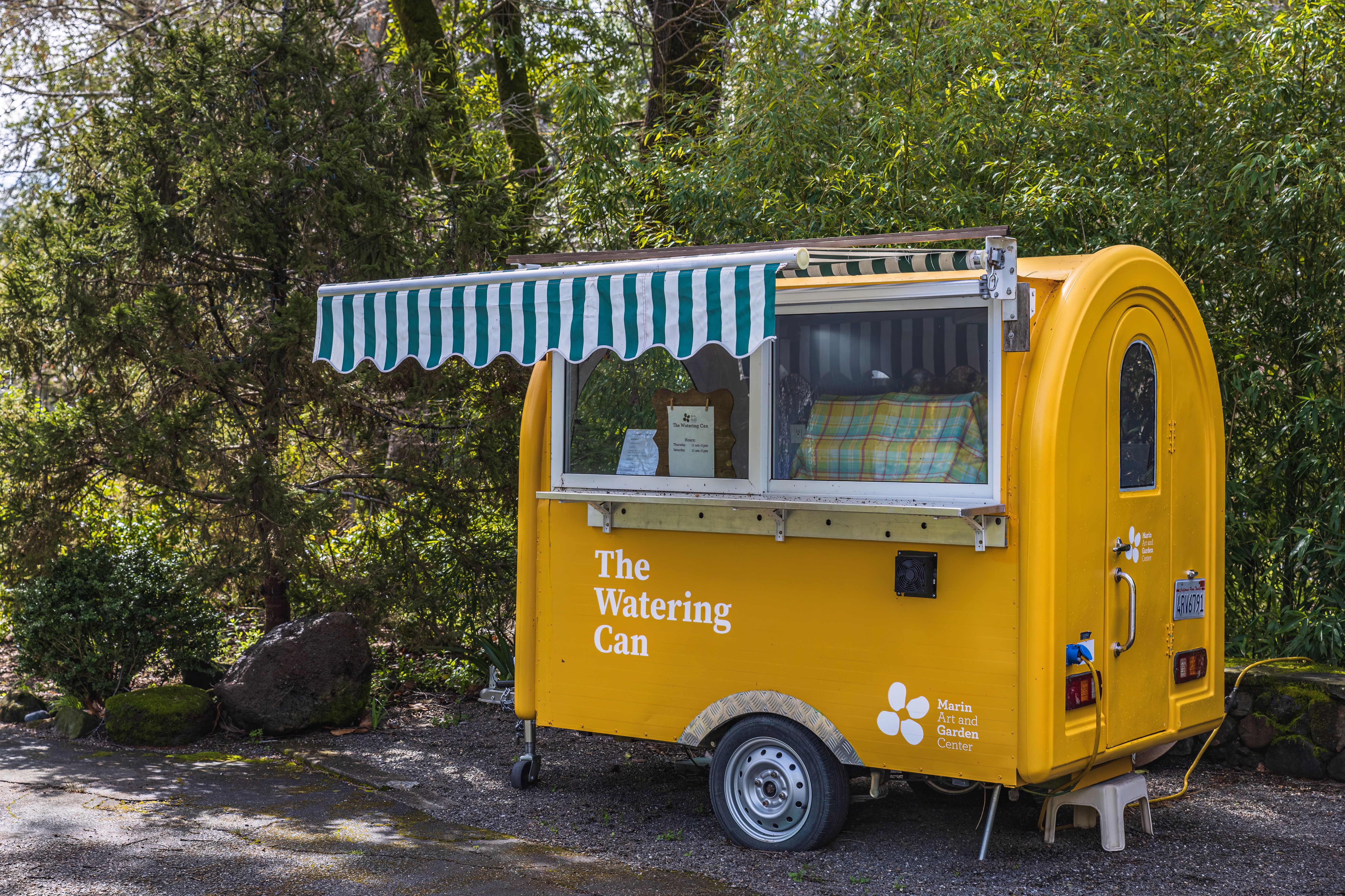 Yellow Retro Trailer in Park · Free Stock Photo