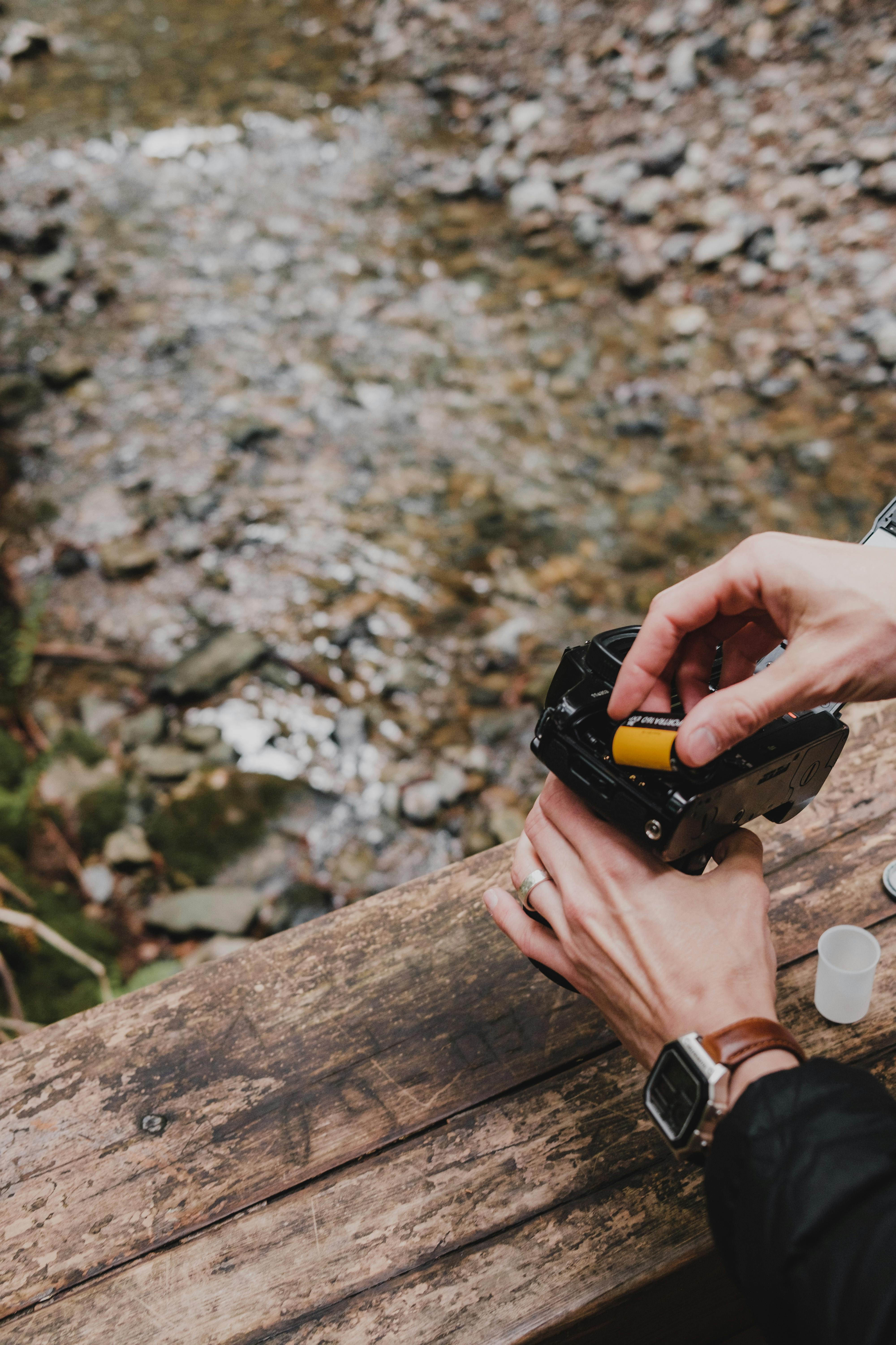 Man Replacing Film in Analog Camera · Free Stock Photo