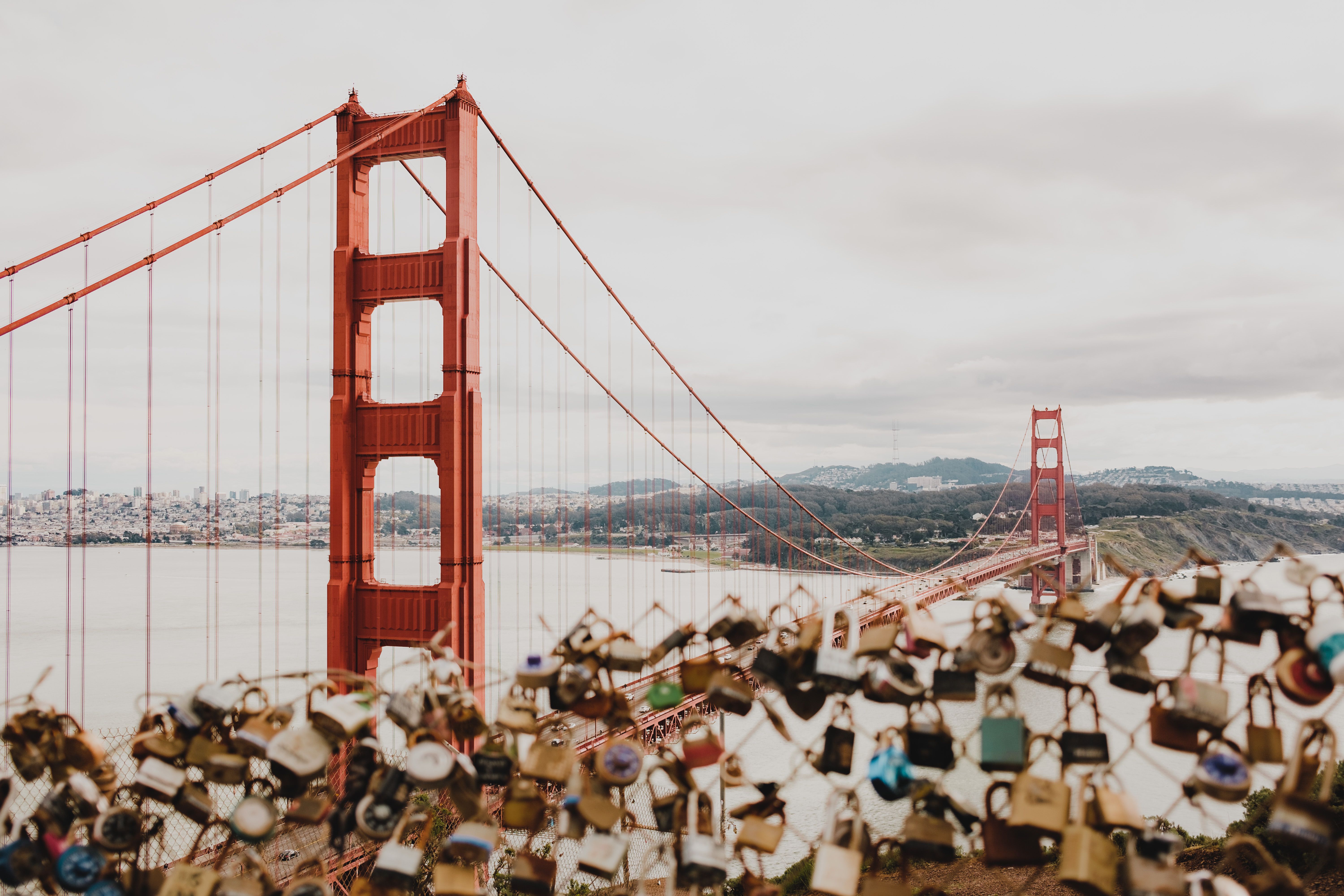 Red Suspension Bridge and Lockers Attached to a Net Fence · Free Stock ...