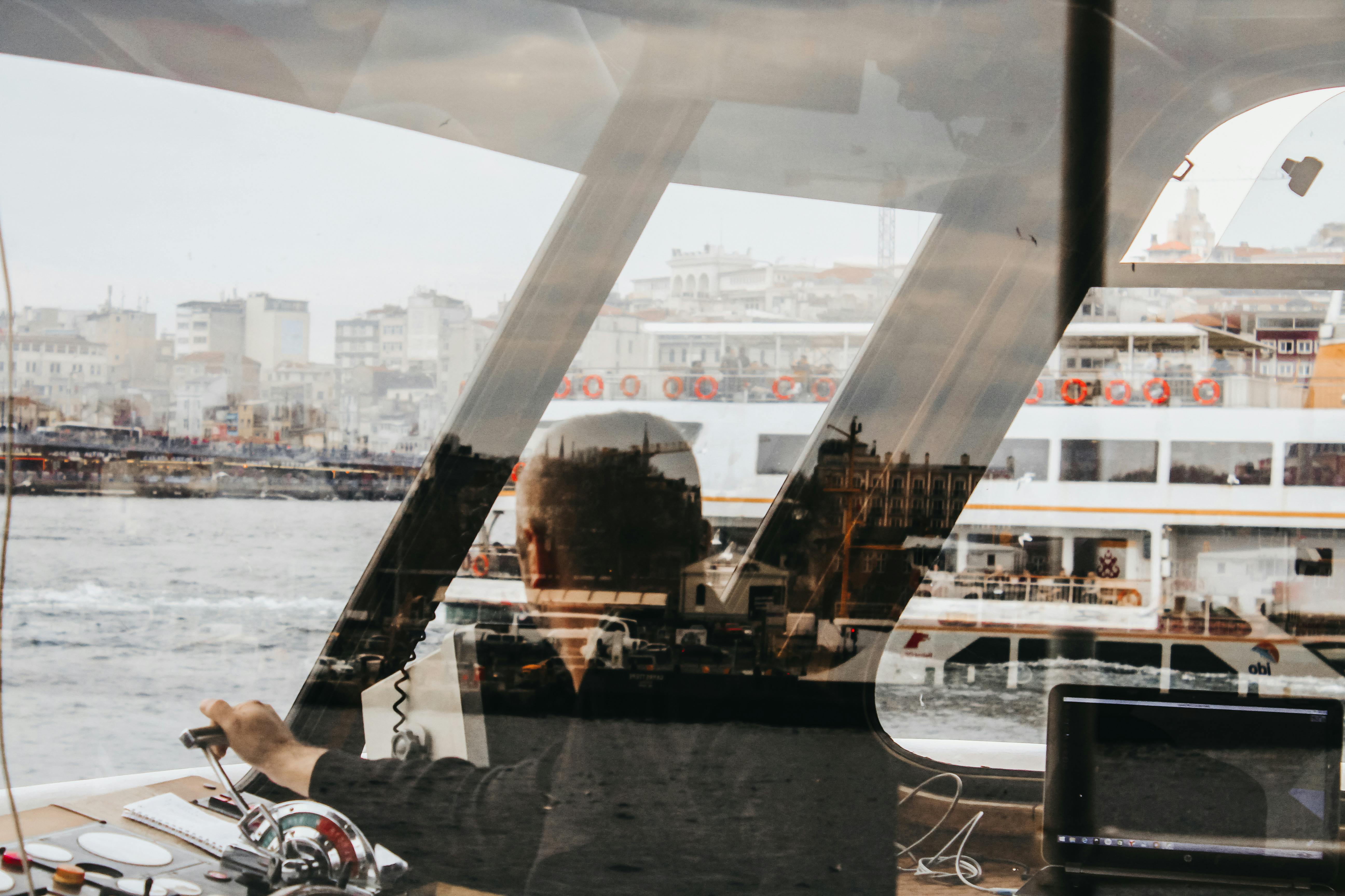 A Helmsman Steering a Passenger Ship in the Bosphorus Strait · Free ...