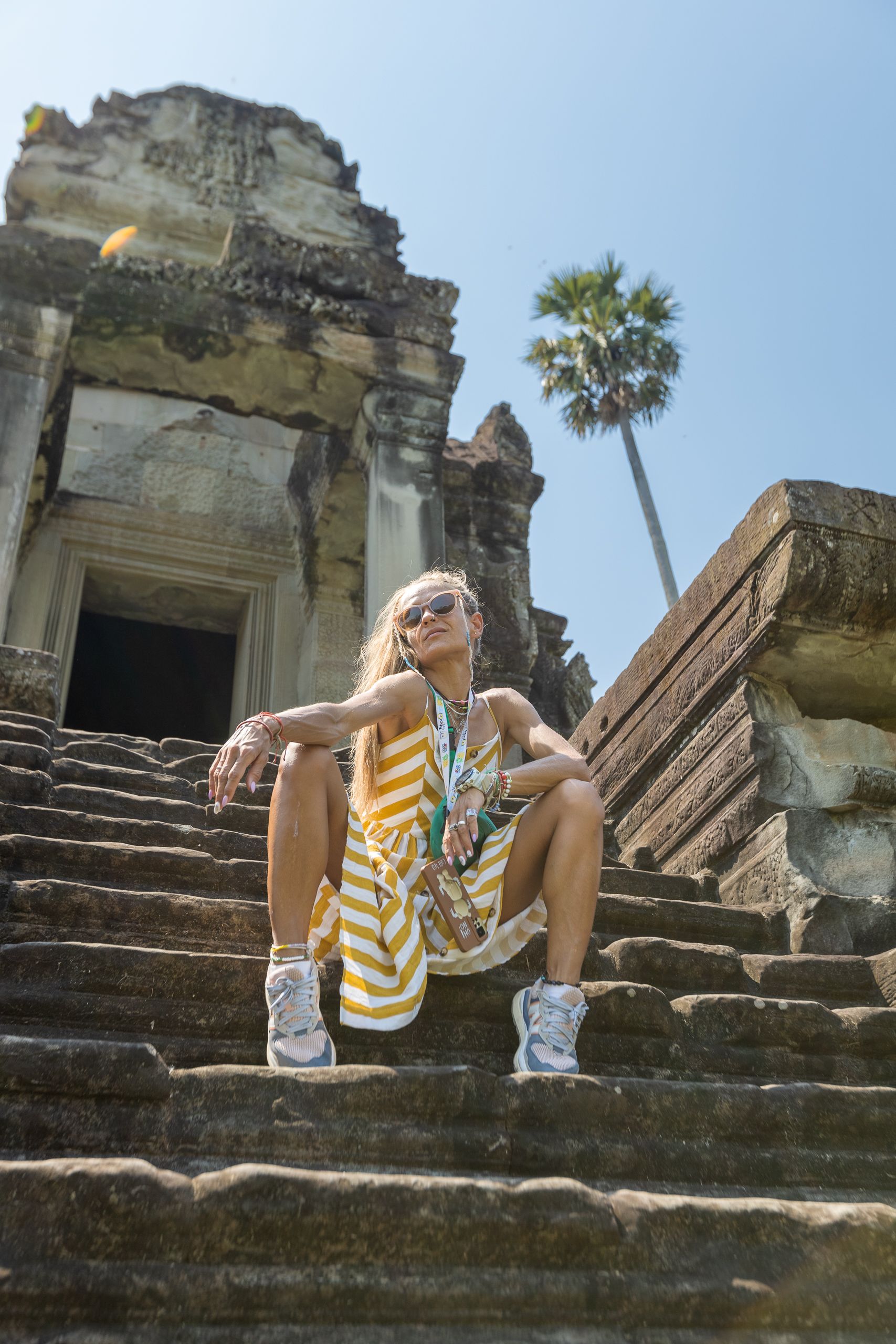 Woman Sitting on the Steps of a Temple · Free Stock Photo