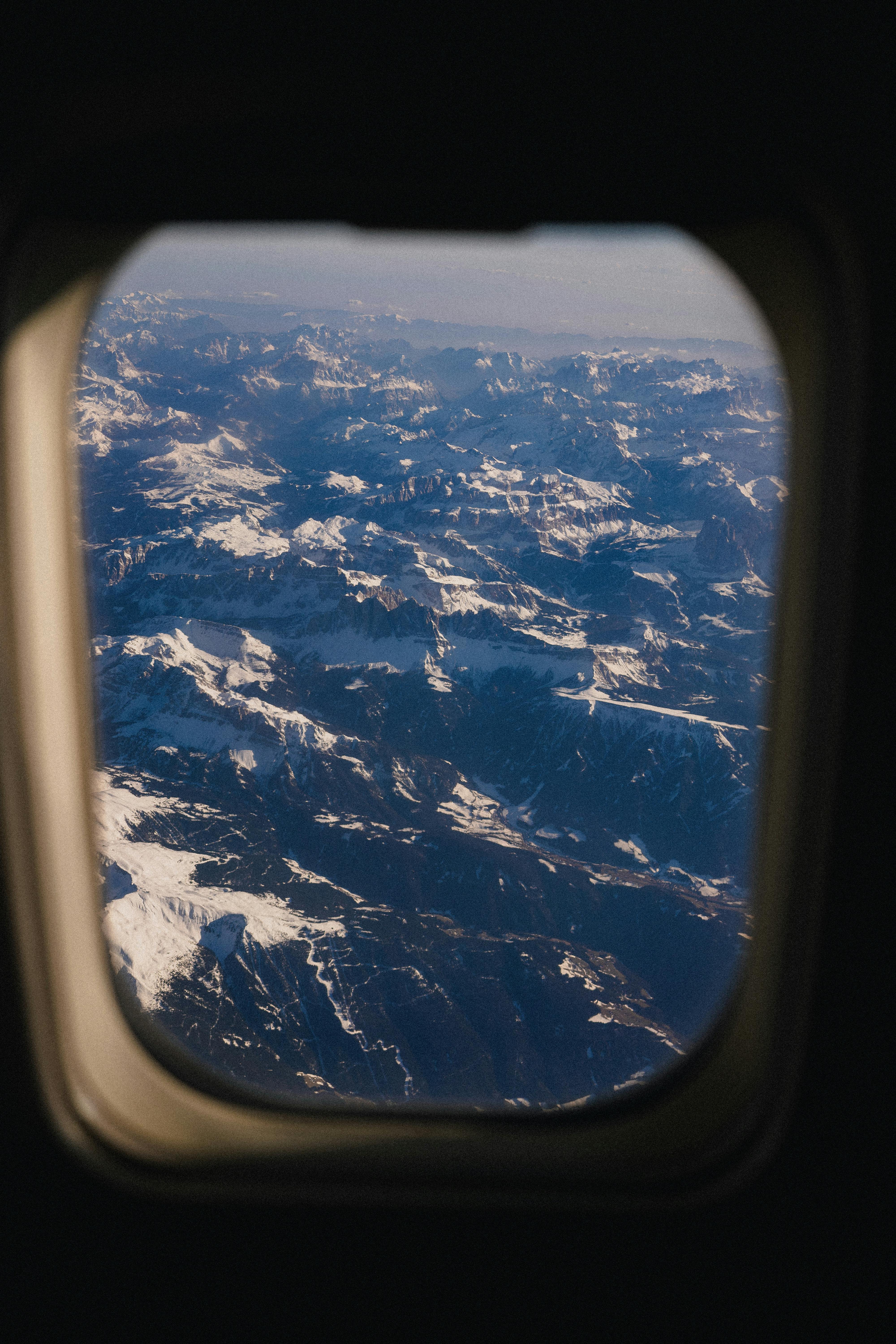 Snowcapped Mountains Photographed from an Airplane · Free Stock Photo