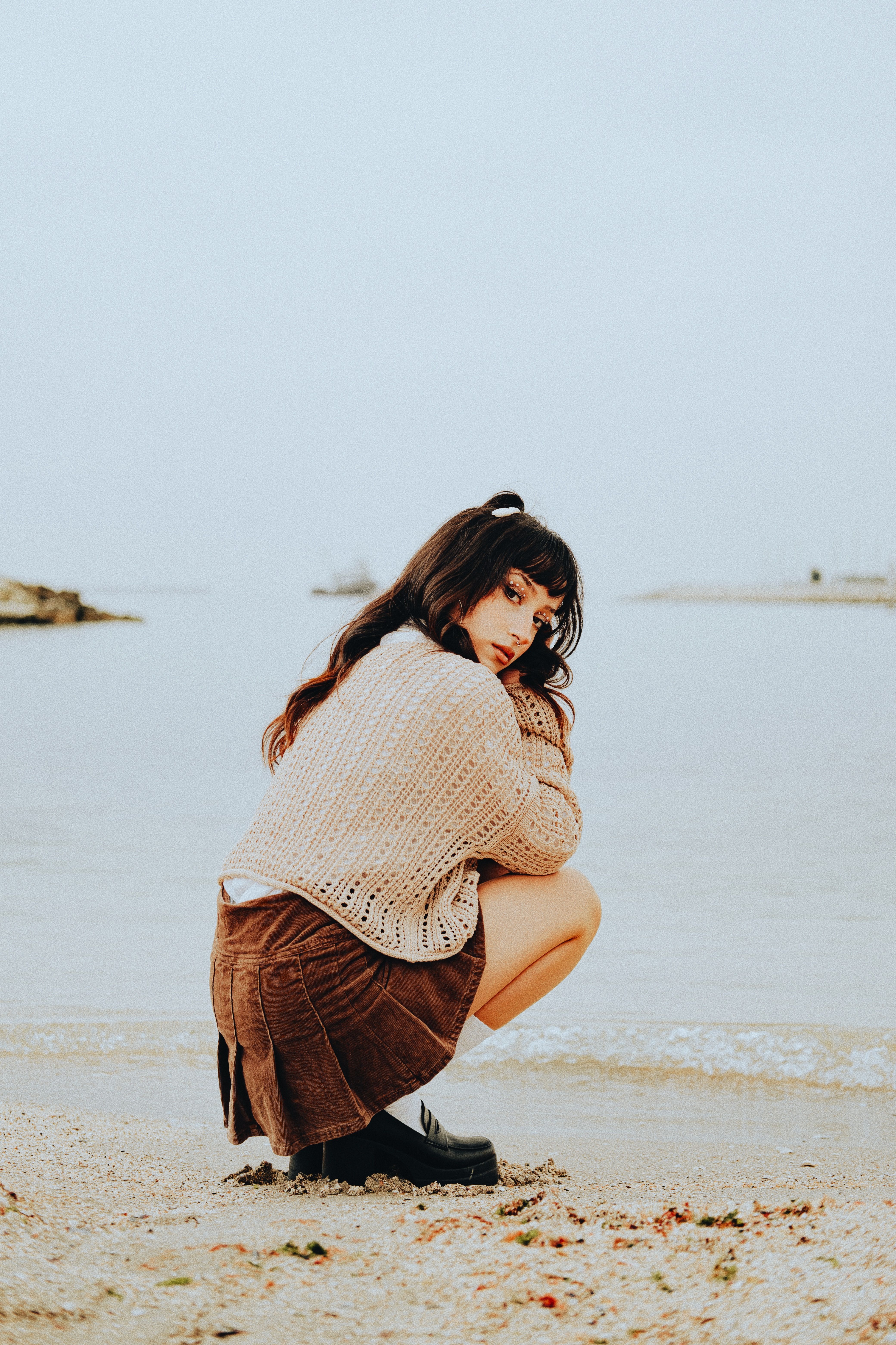 Crouching Woman Posing on Street · Free Stock Photo