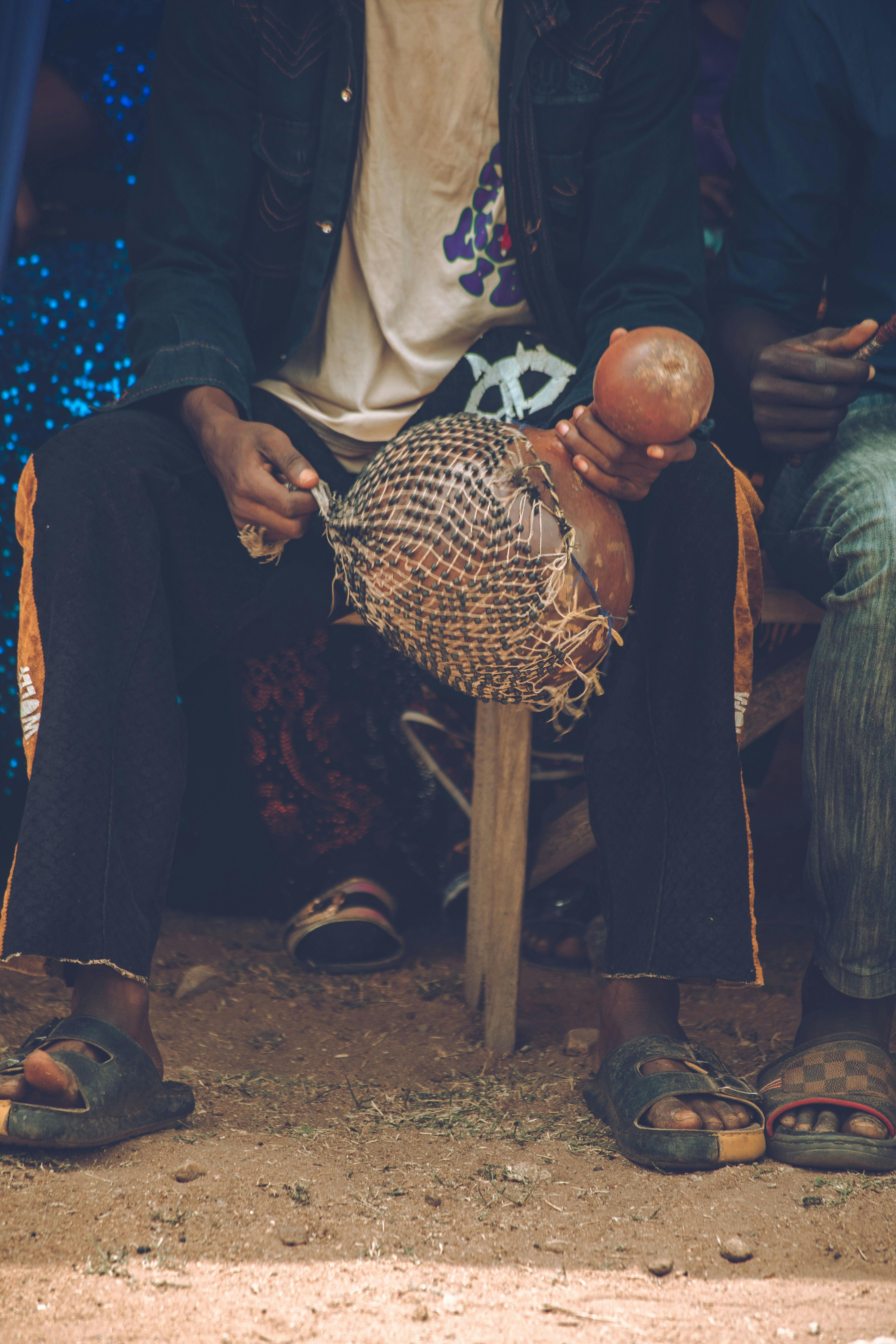 Playing the Shekere Rattle · Free Stock Photo