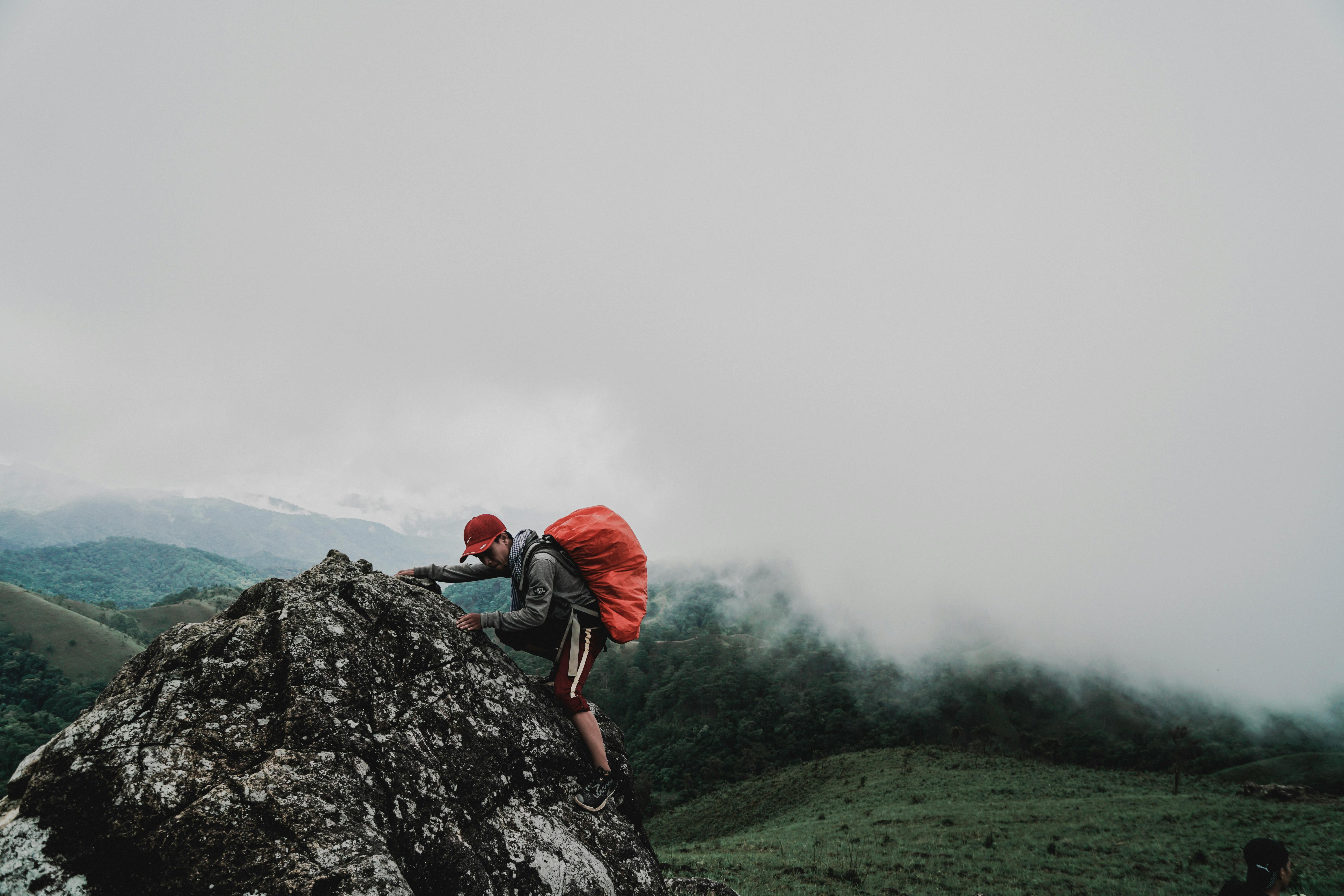 A Man Climbing a Mountain · Free Stock Photo