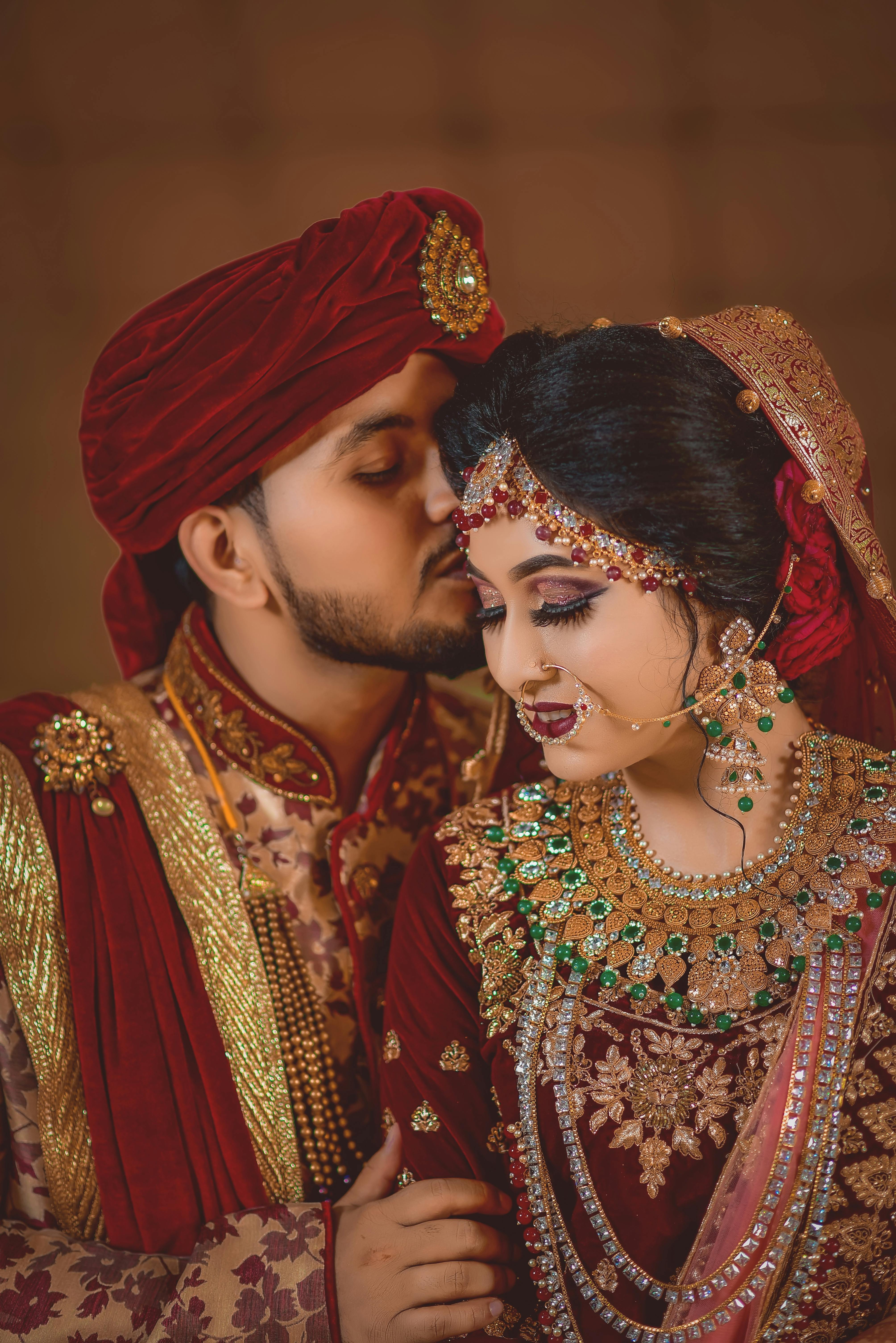 Bride and Groom Wearing Traditional Clothing and Jewelry · Free Stock Photo
