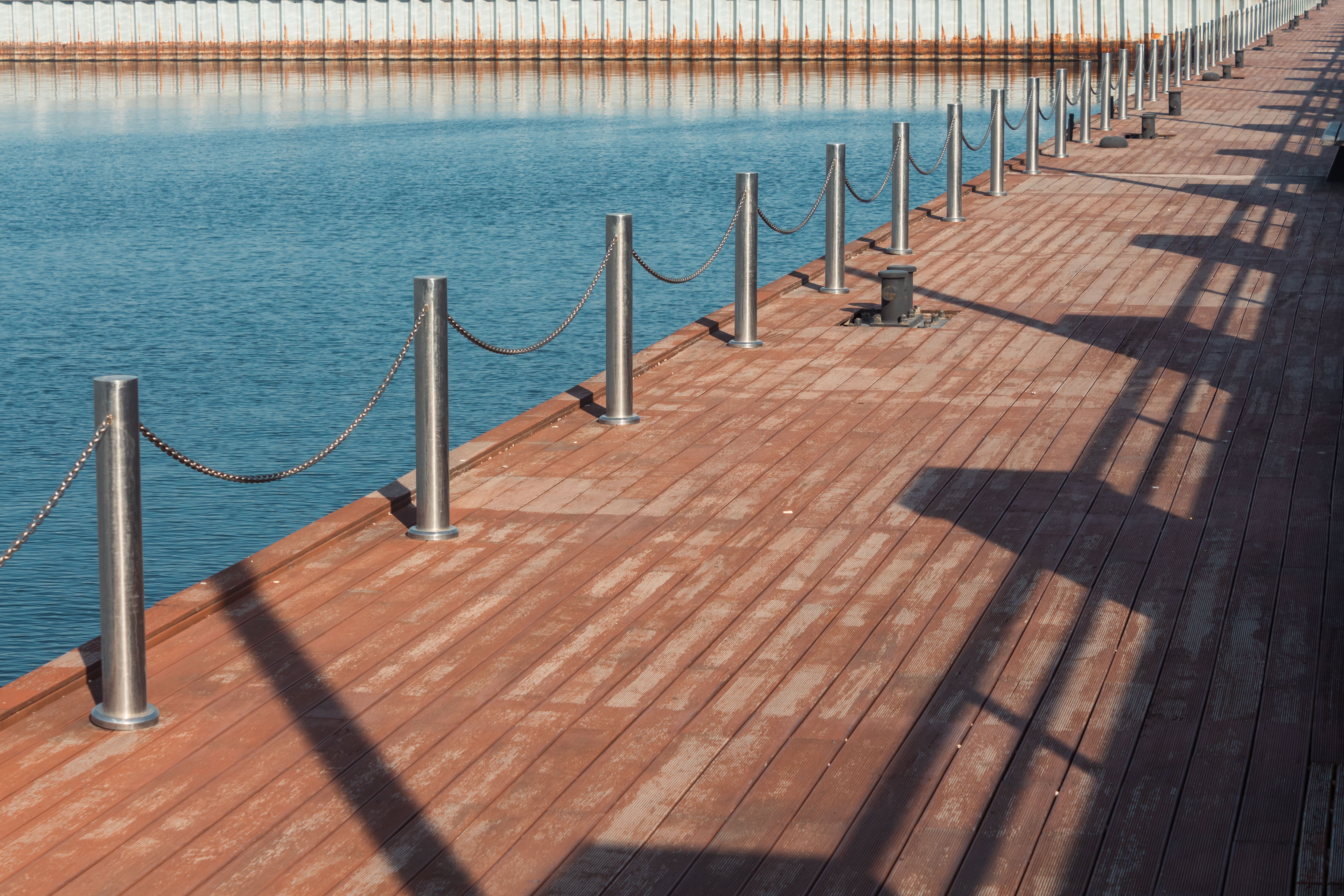 A Wooden Pier and Blue Water · Free Stock Photo