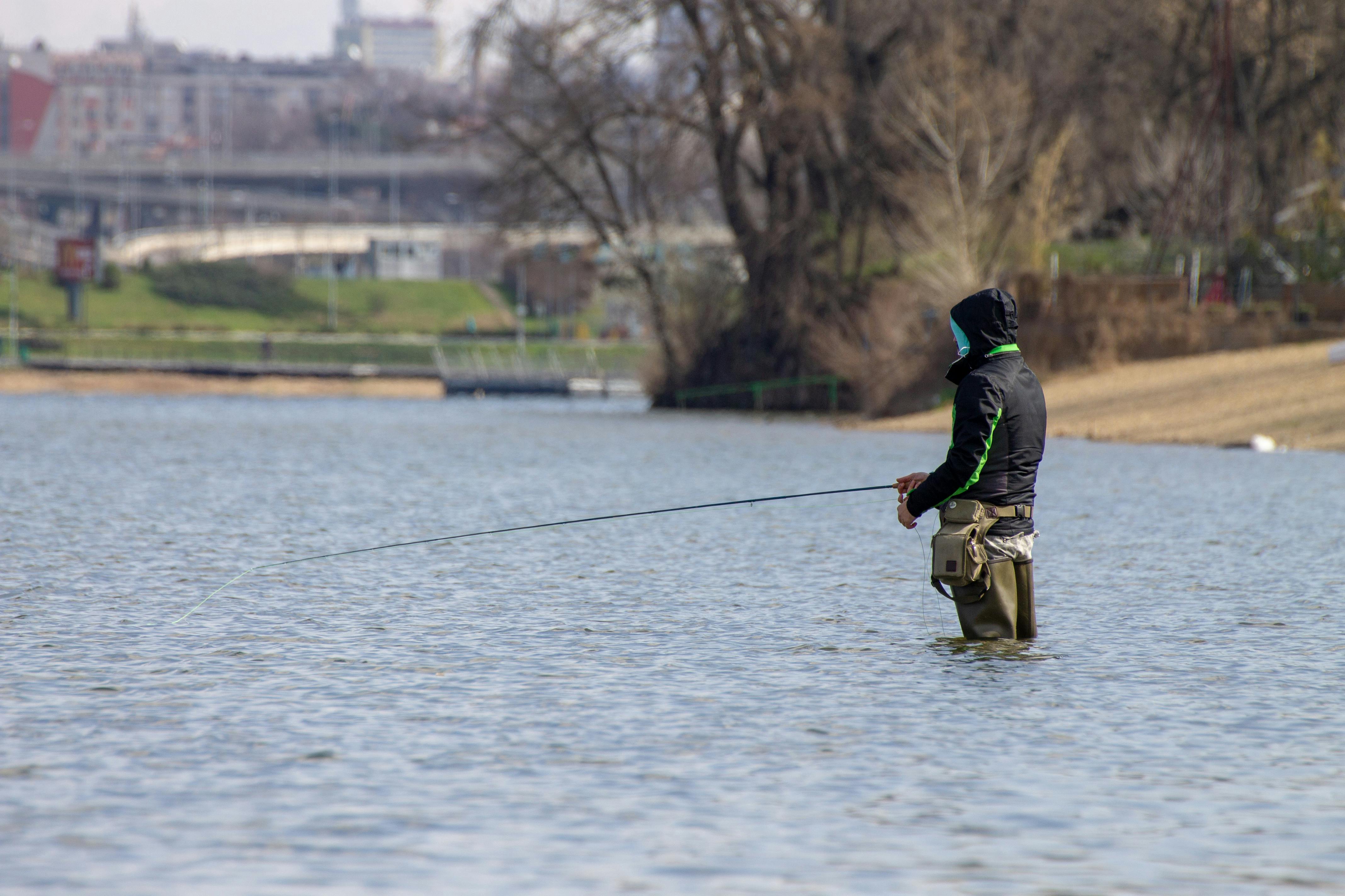 Fishing Man Wearing Yellow Shirt · Free Stock Photo