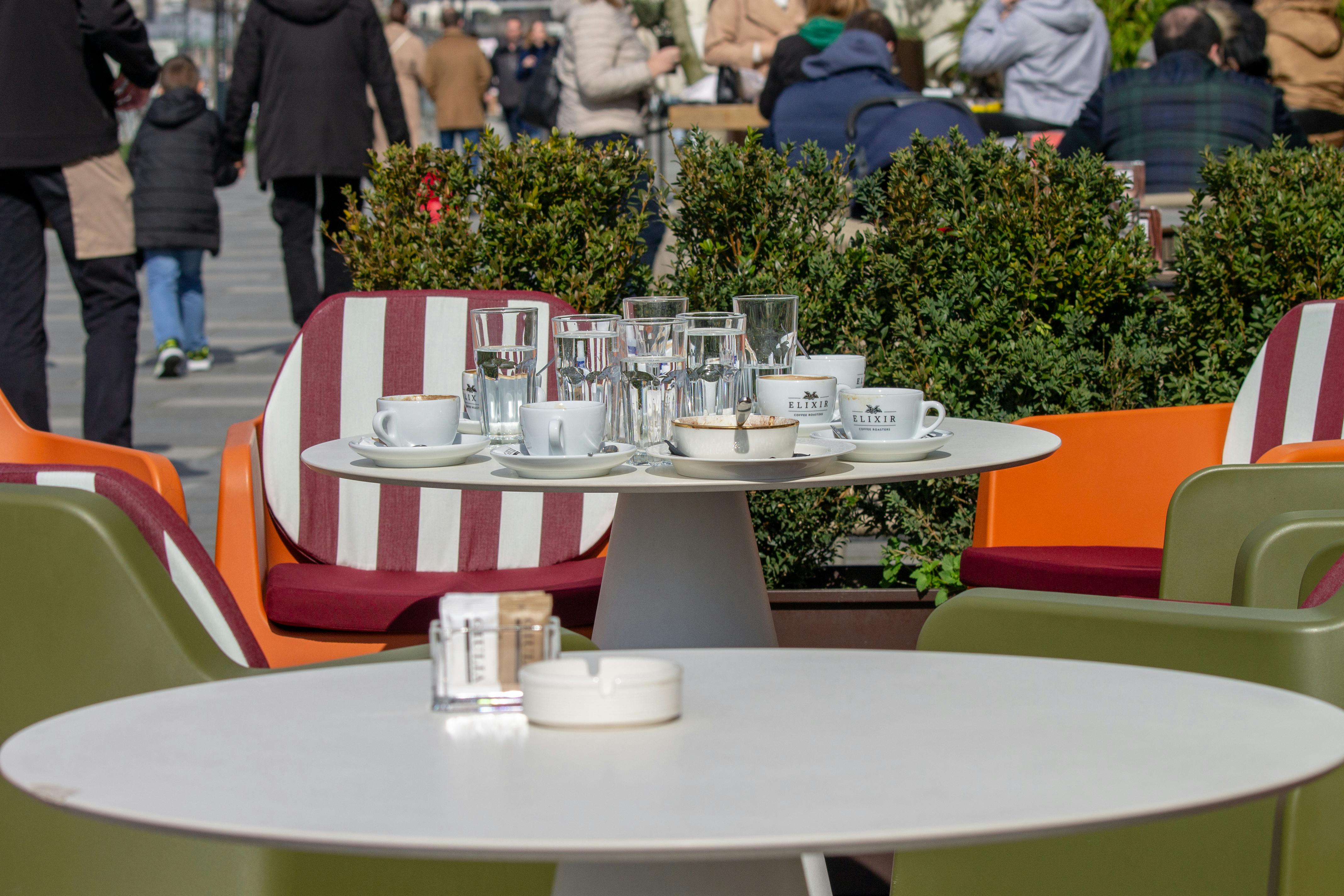 Group Of Men Outside A Coffee Shop · Free Stock Photo