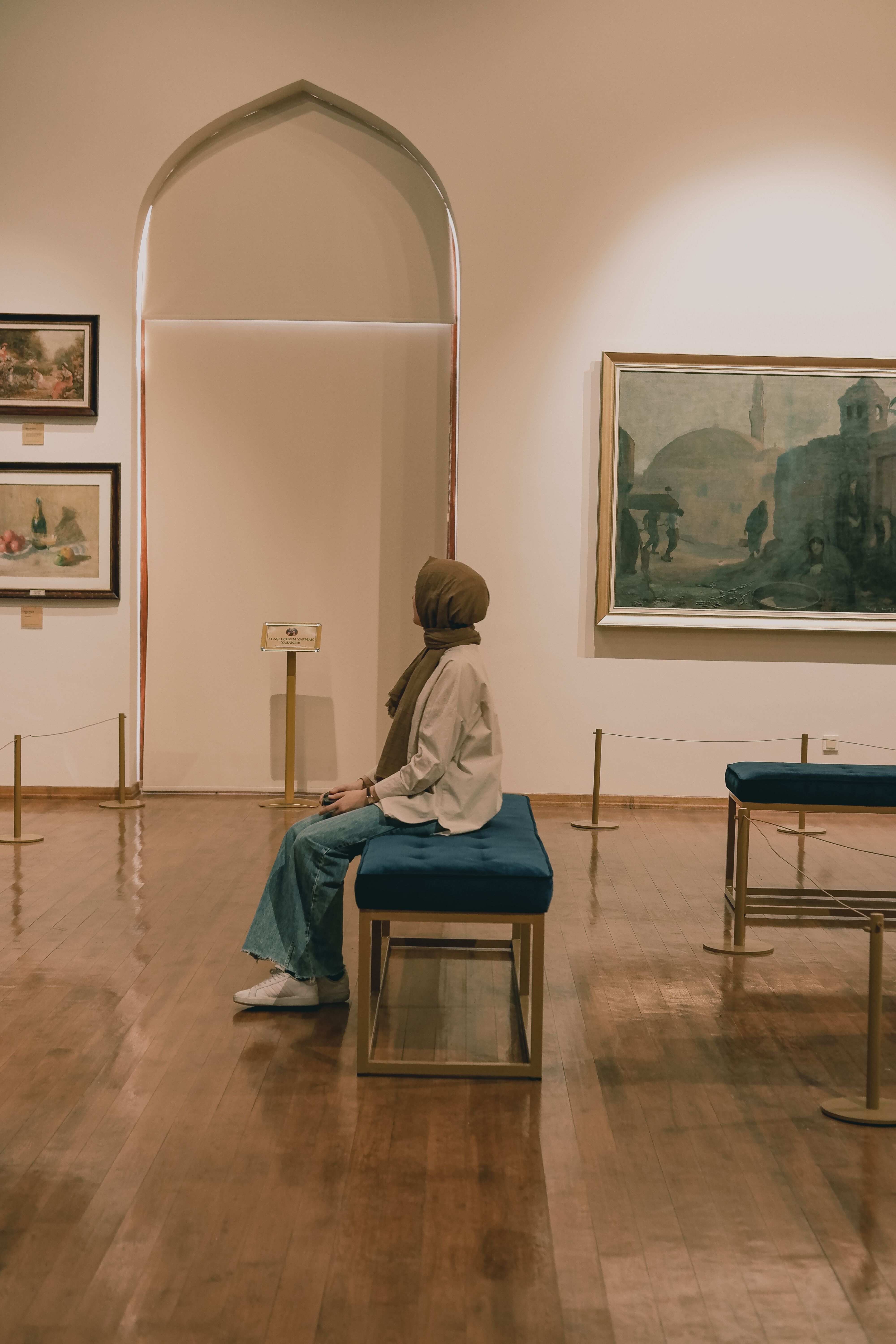Woman Sitting in Museum · Free Stock Photo