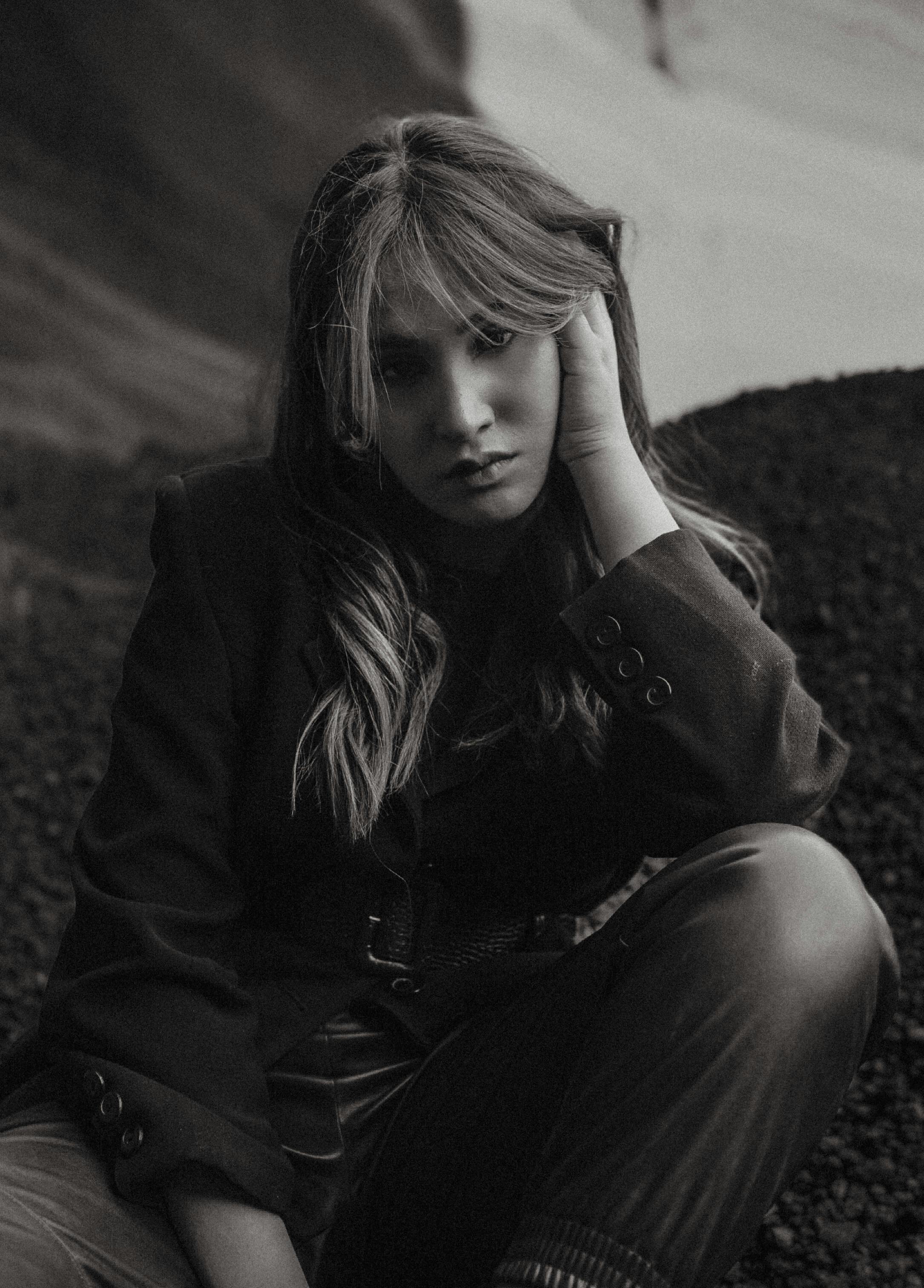 Dark Photo of a Man Wearing a White Straitjacket Sitting on a Bed ...