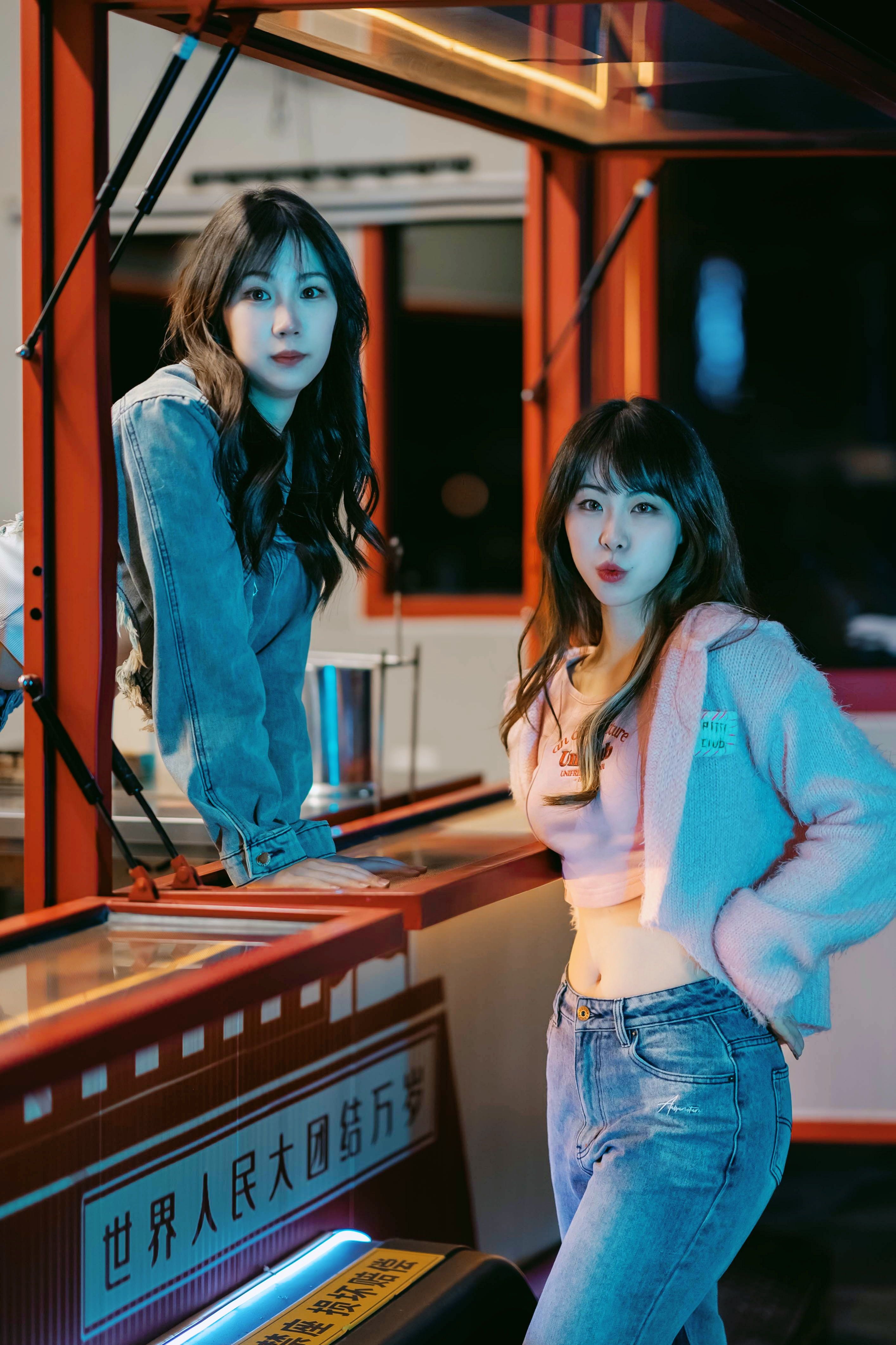 Brunette Women Posing in Window at Night · Free Stock Photo