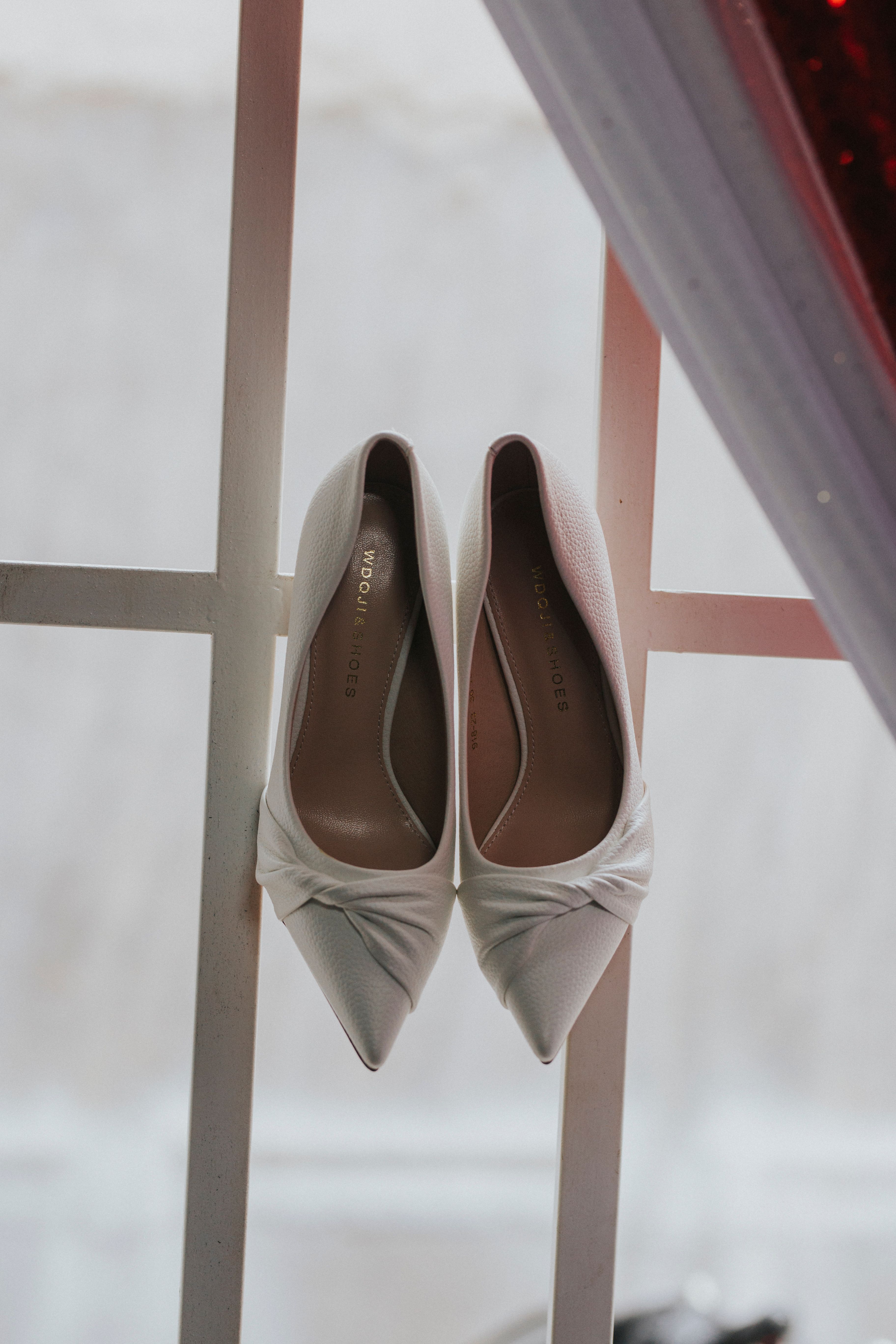 Classic High Heels Hanging on Window · Free Stock Photo