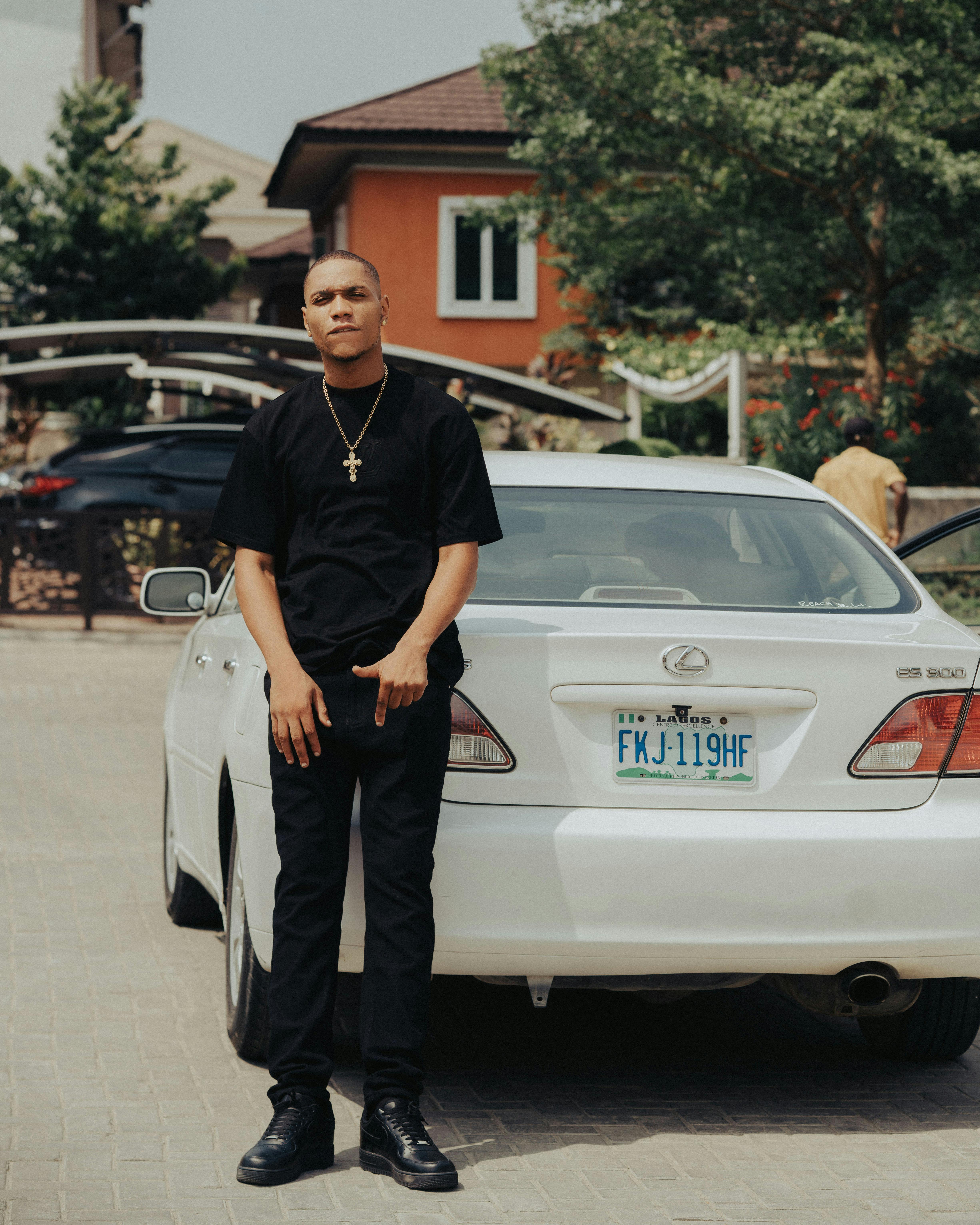 Man Leaning on Lexus Car · Free Stock Photo