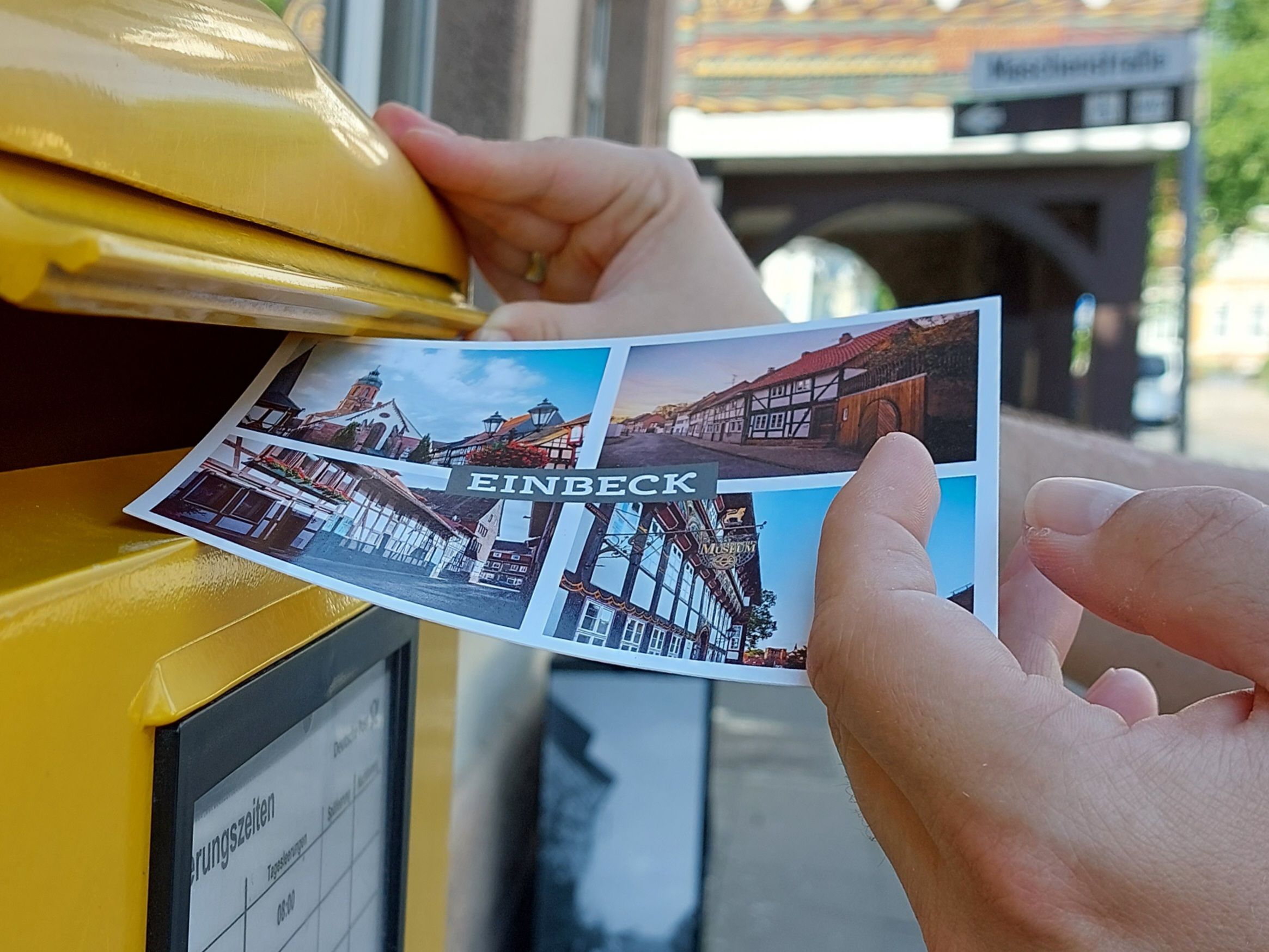 Close-up of Man Throwing Postcard in Mailbox · Free Stock Photo