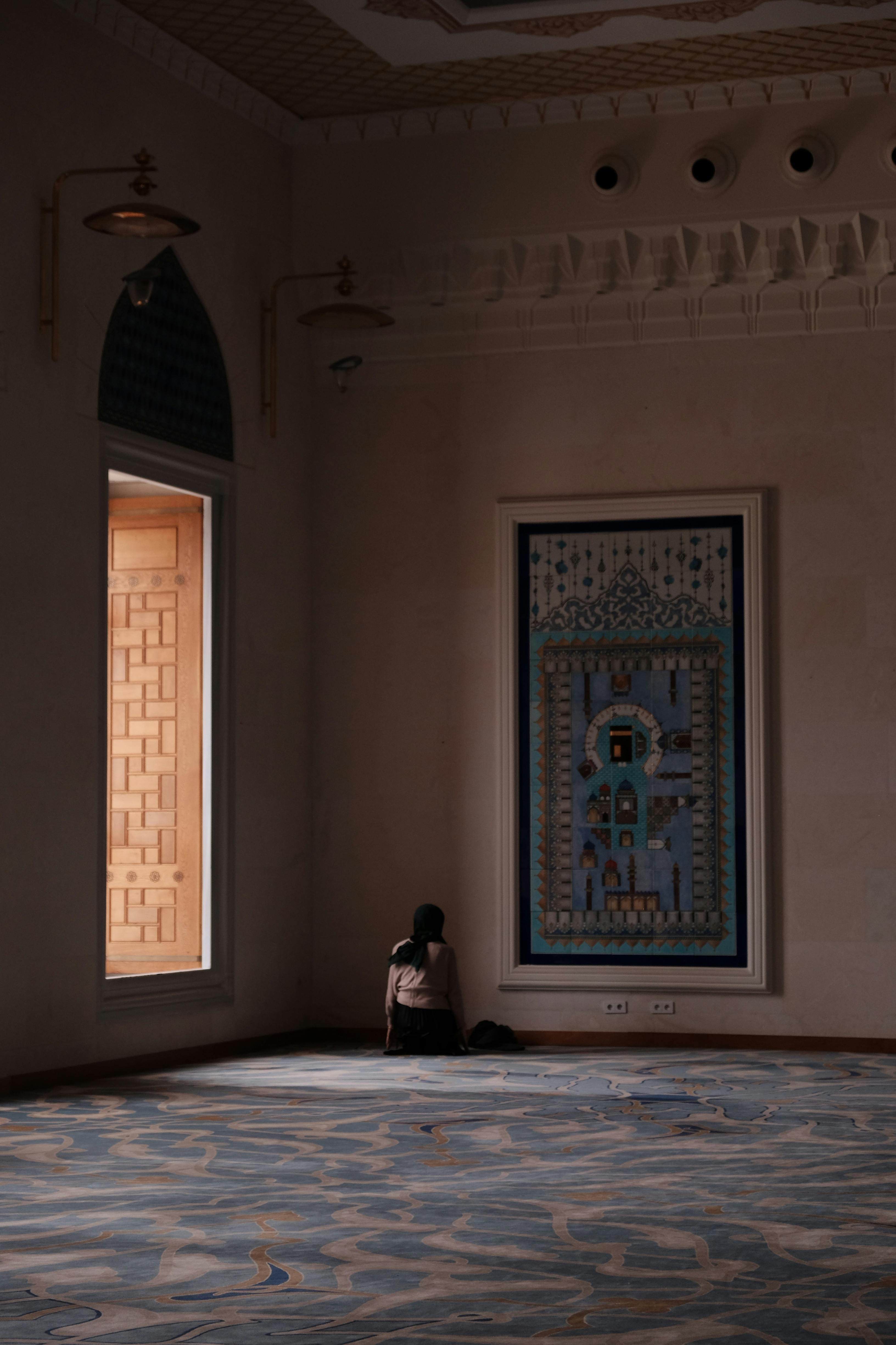 Woman Sitting in Mosque Corner · Free Stock Photo