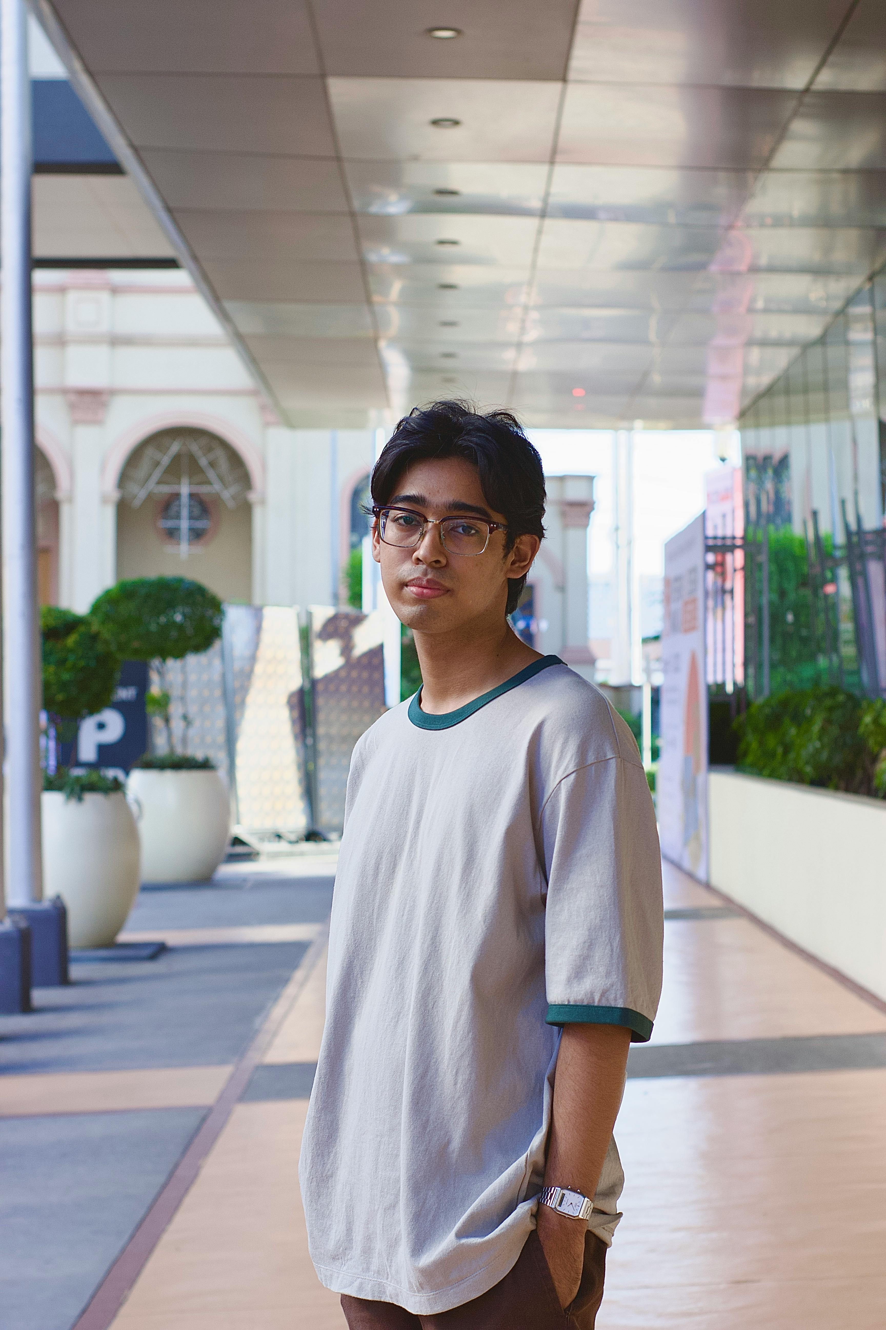 Man Holding Camera and Flashlight · Free Stock Photo