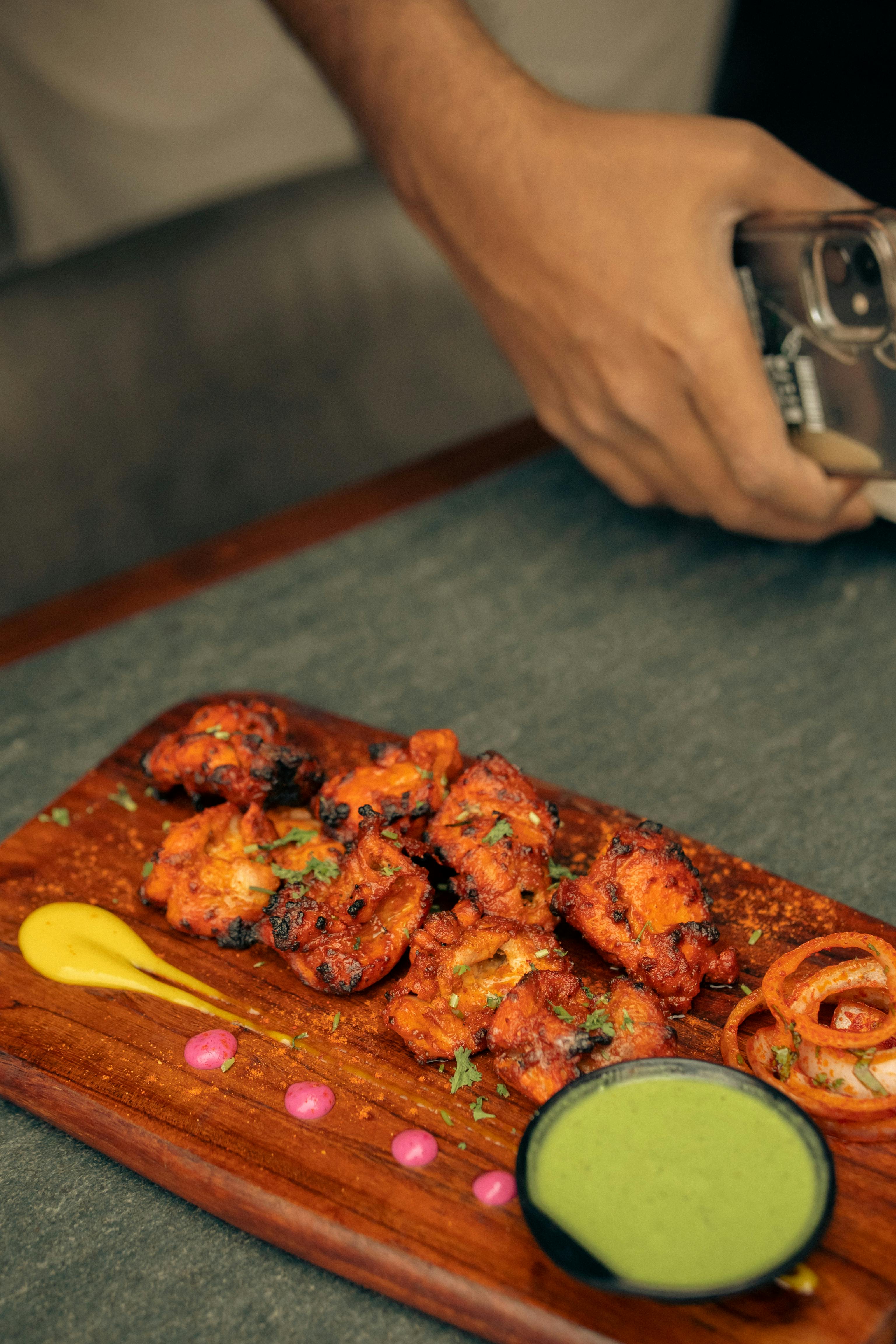 Man Presenting Sushi on a Tray · Free Stock Photo
