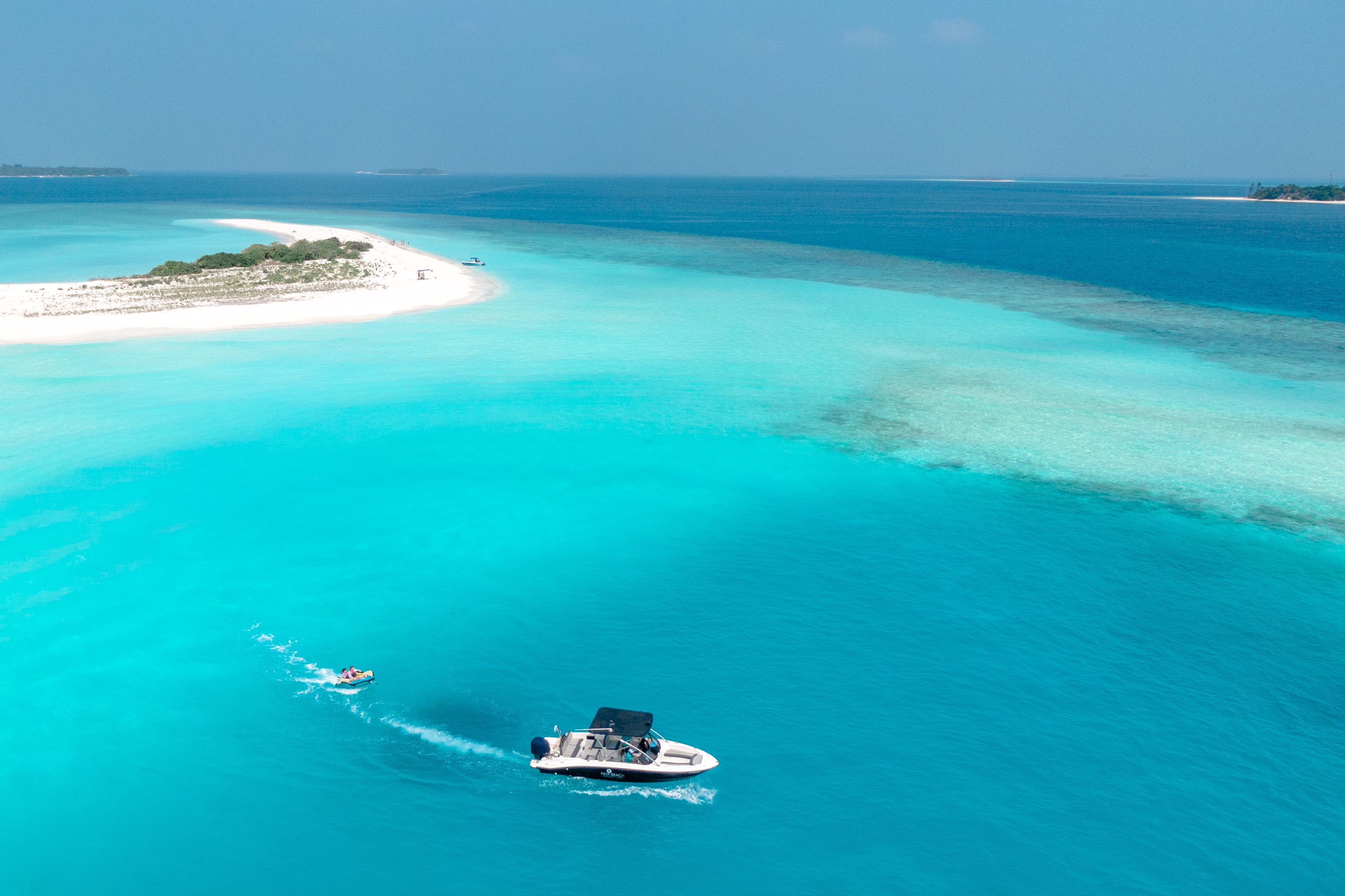 Boat on the Sea by an Island · Free Stock Photo