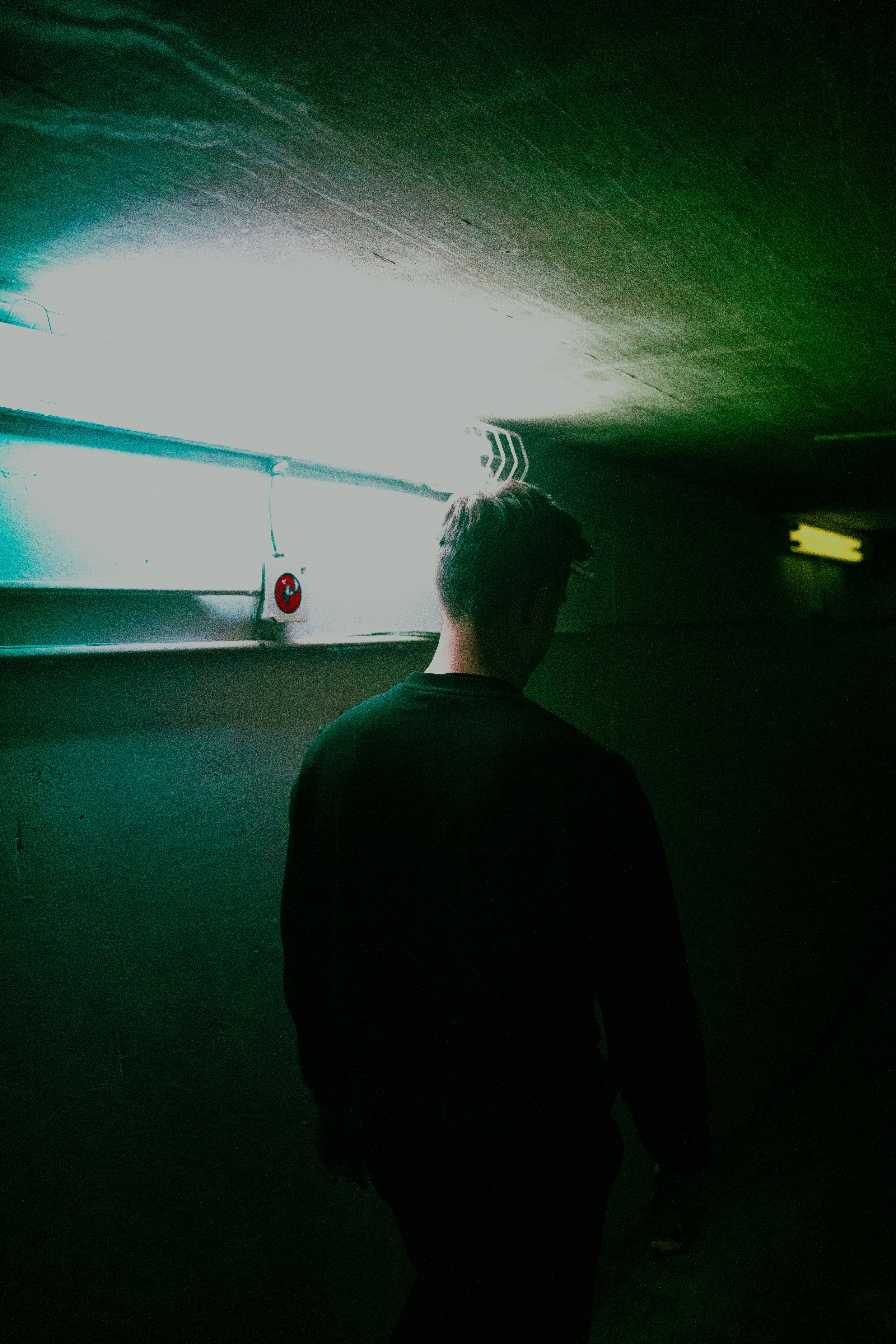 Silhouette Of Man Standing Under Lamp Post · Free Stock Photo