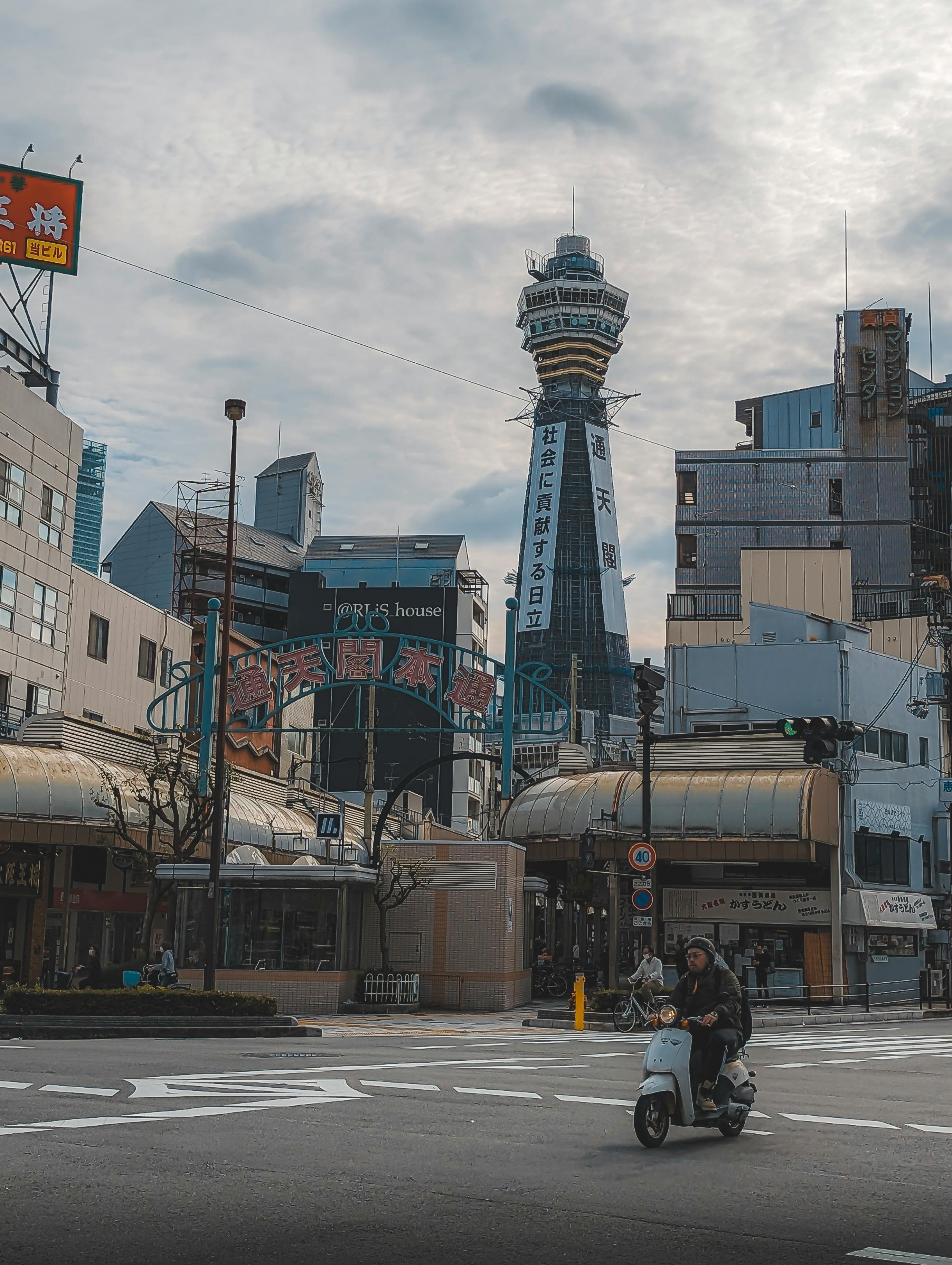 A City Street with the View of Tsutenkaku in Osaka, Japan · Free Stock ...