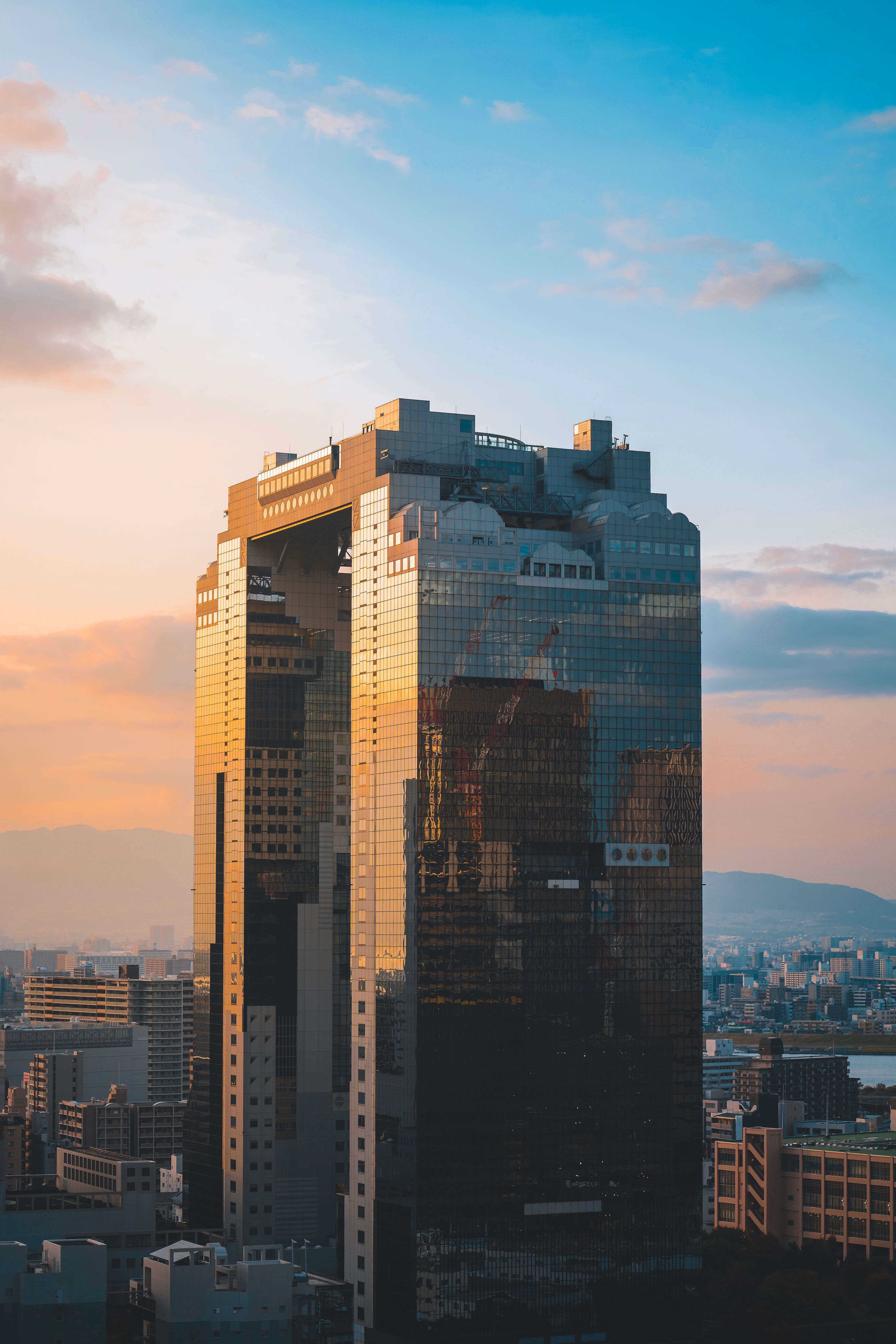 Modern Glass Skyscrapers on Sunset Sky · Free Stock Photo