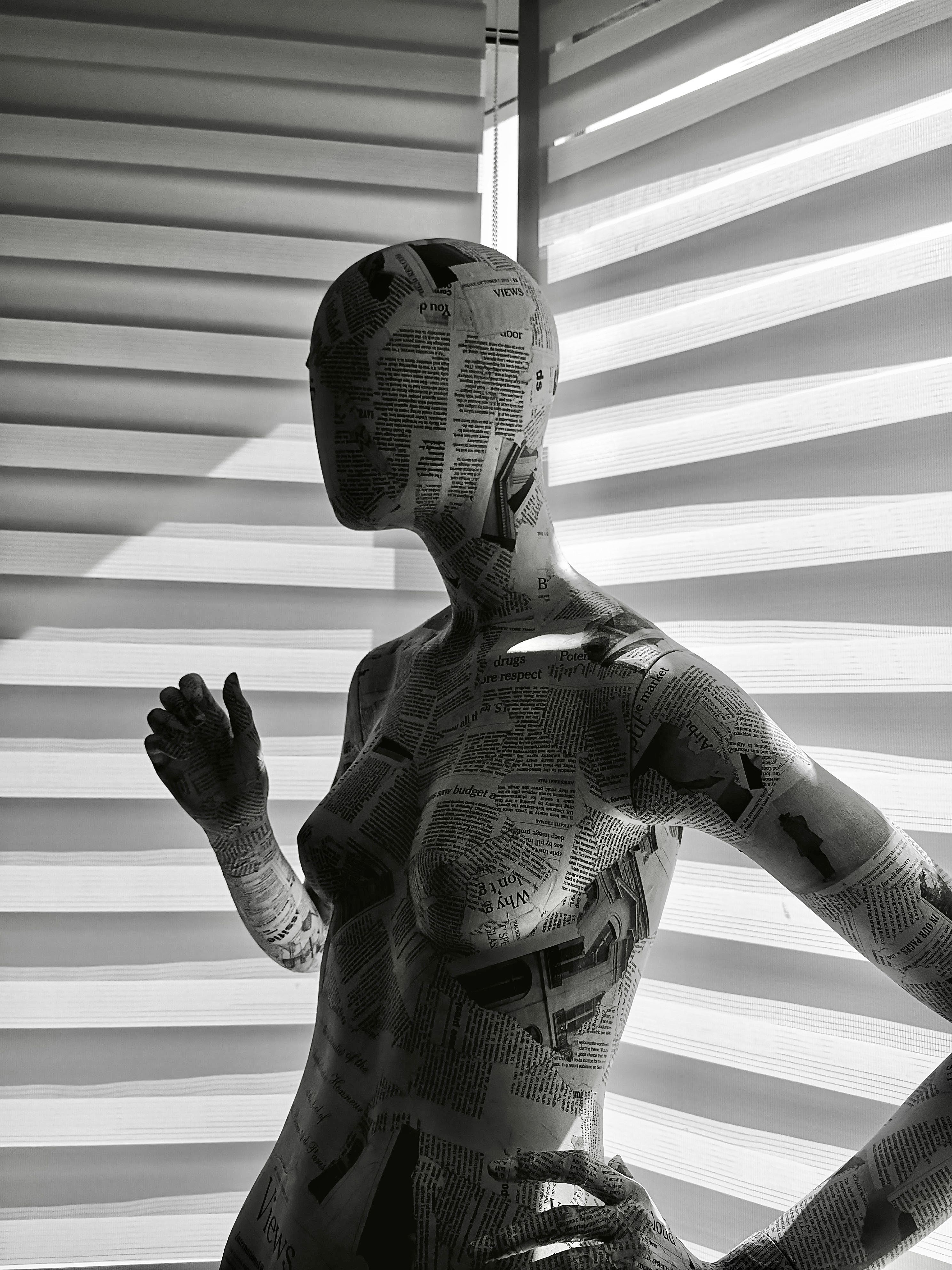 Mannequin in Newspapers · Free Stock Photo