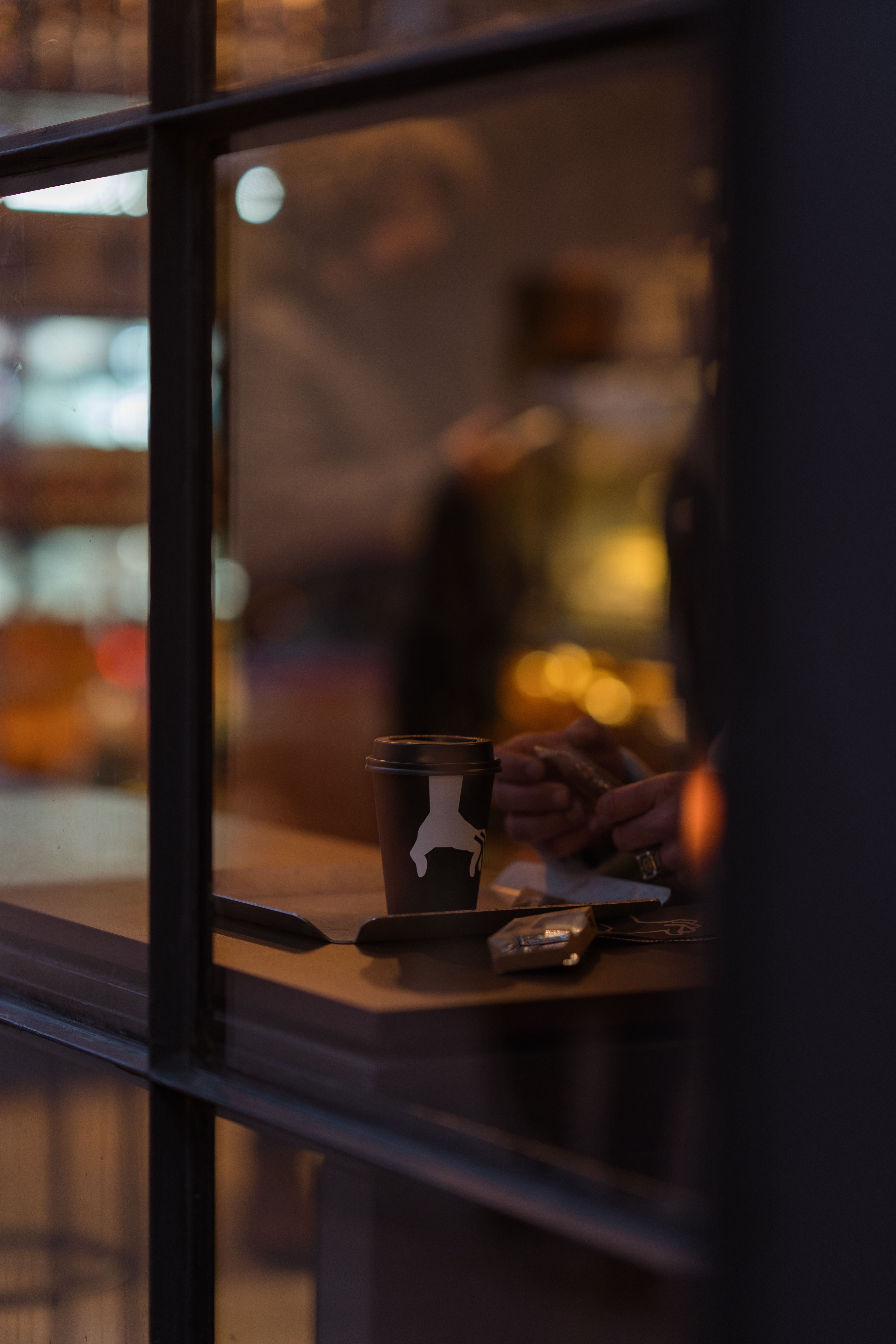Coffee Cup Seen through Cafe Window · Free Stock Photo