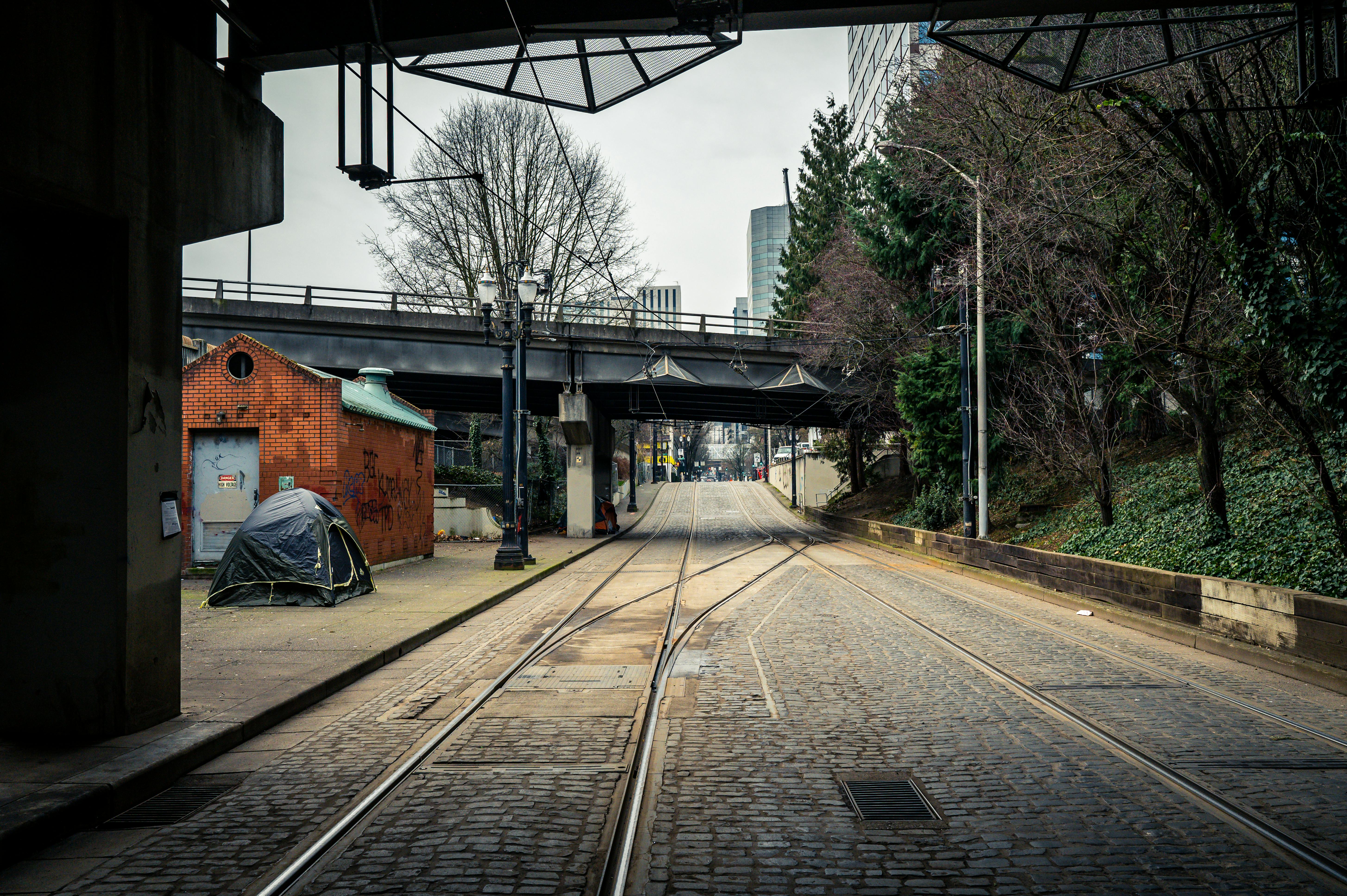 City Street with Railway Tracks · Free Stock Photo