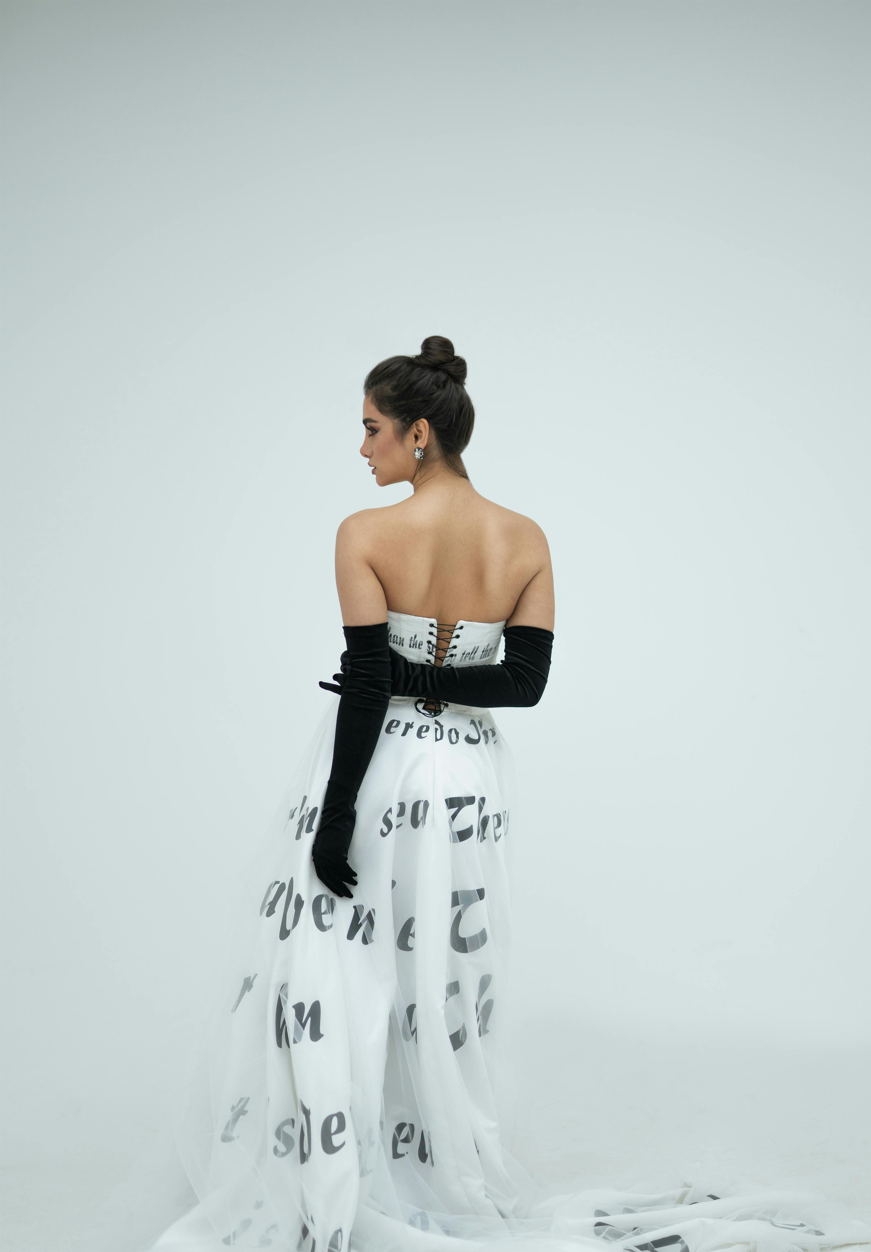 A Woman in a Black and White Dress · Free Stock Photo