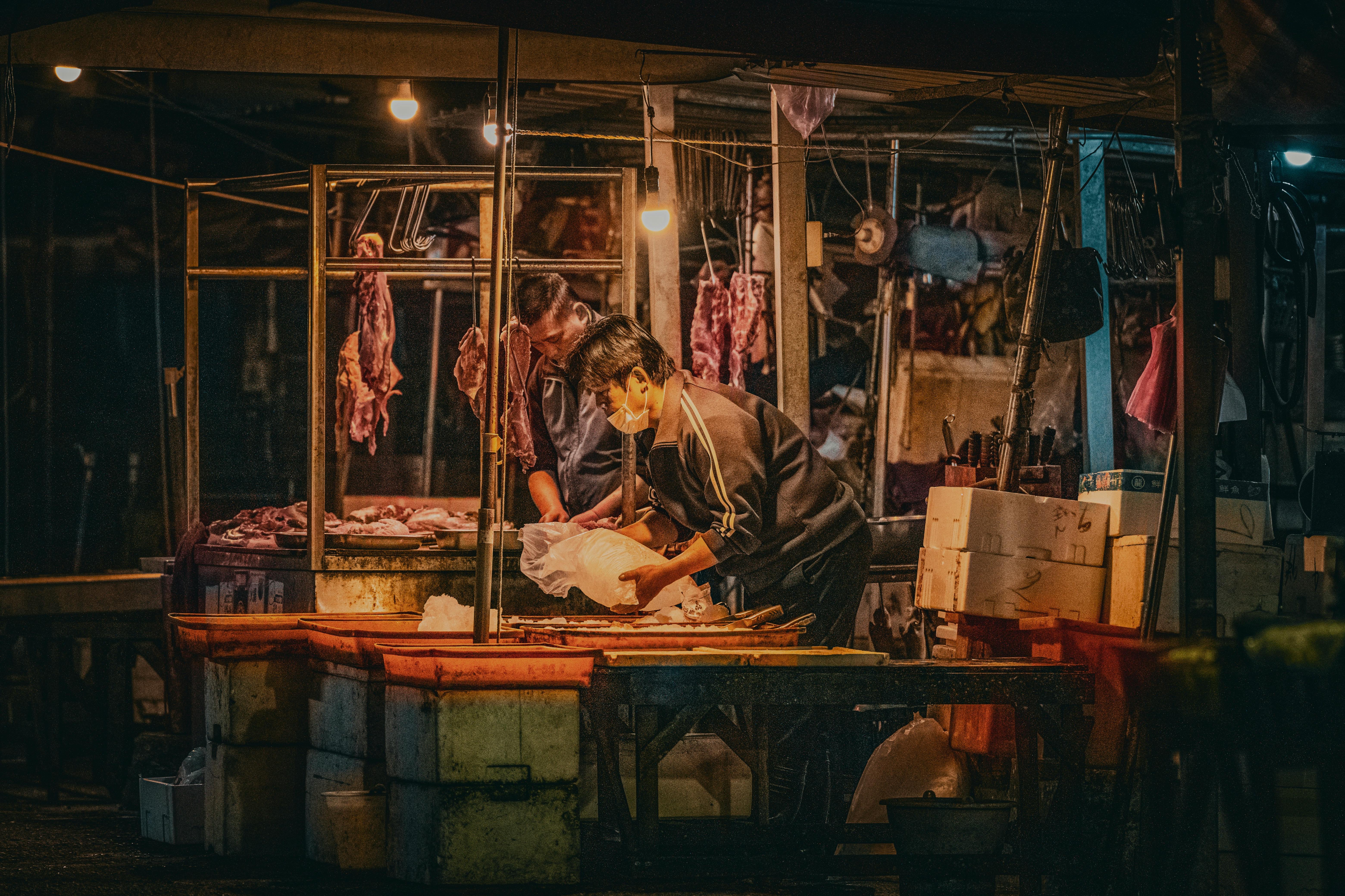 People Working on Food Stand at Night · Free Stock Photo