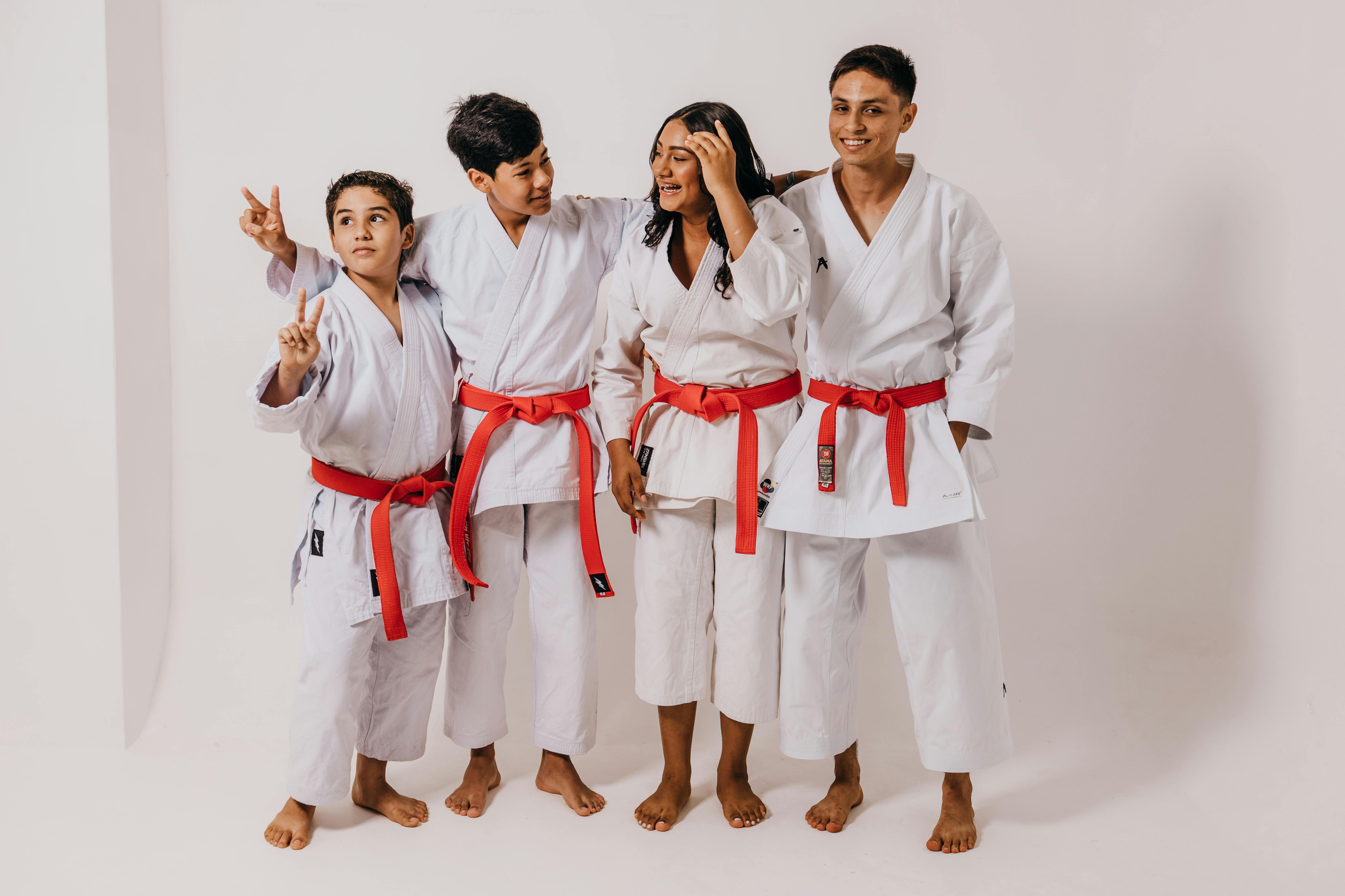 A group of people in karate uniforms posing for a photo · Free Stock Photo