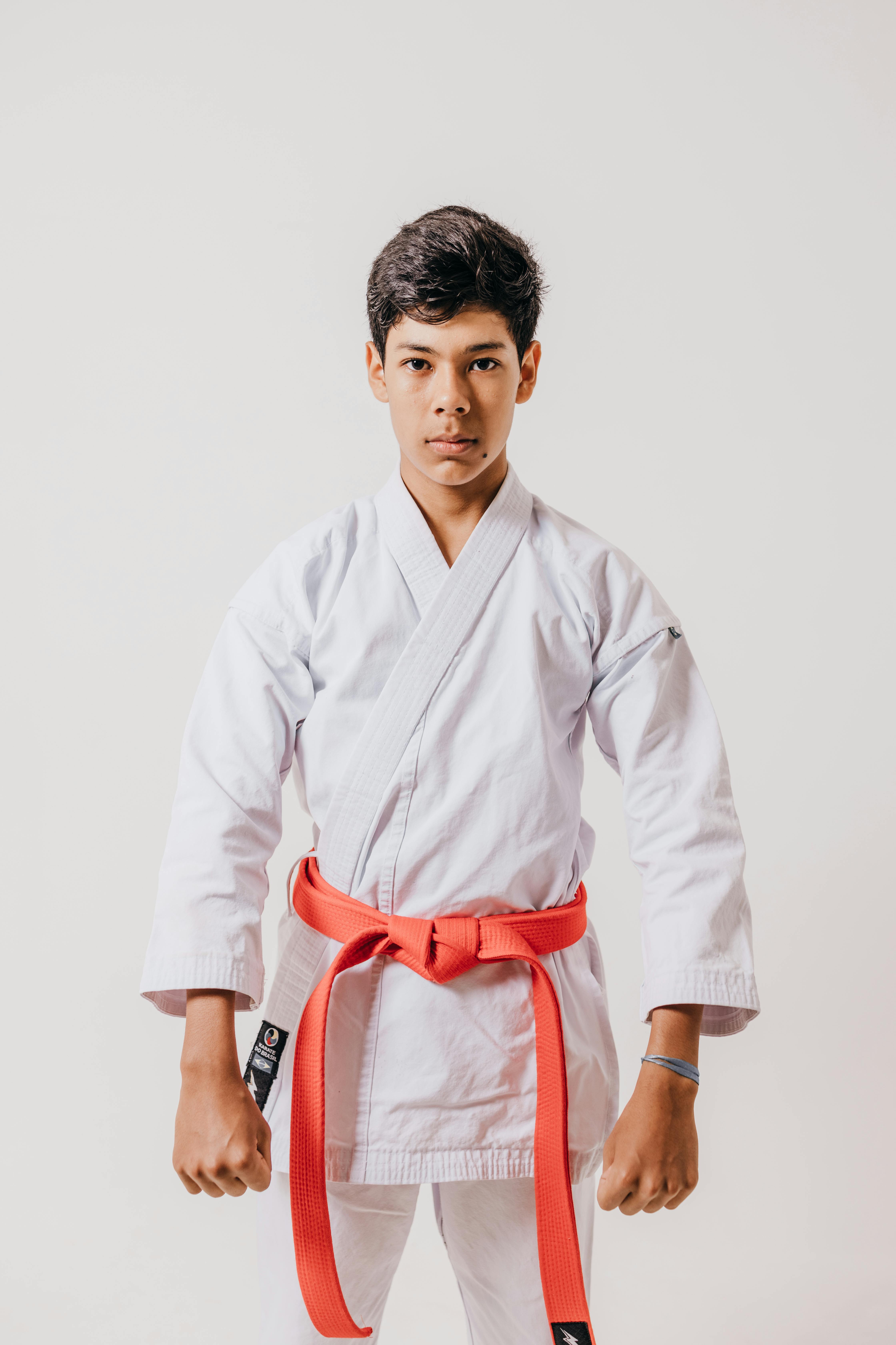 Boy in Karate Sportswear in Aggressive Pose · Free Stock Photo