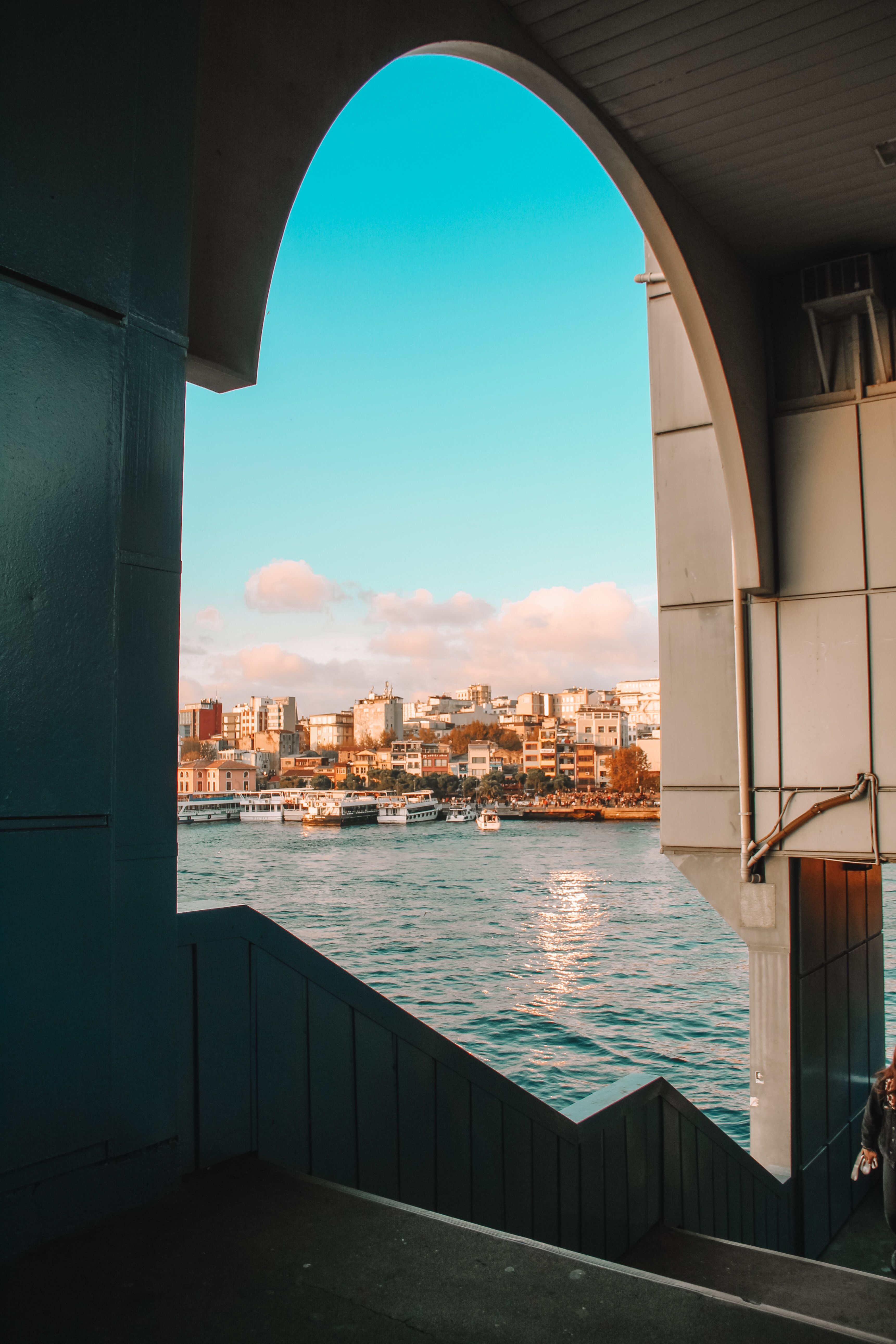 City on Bay Shore seem through Arched Gate · Free Stock Photo