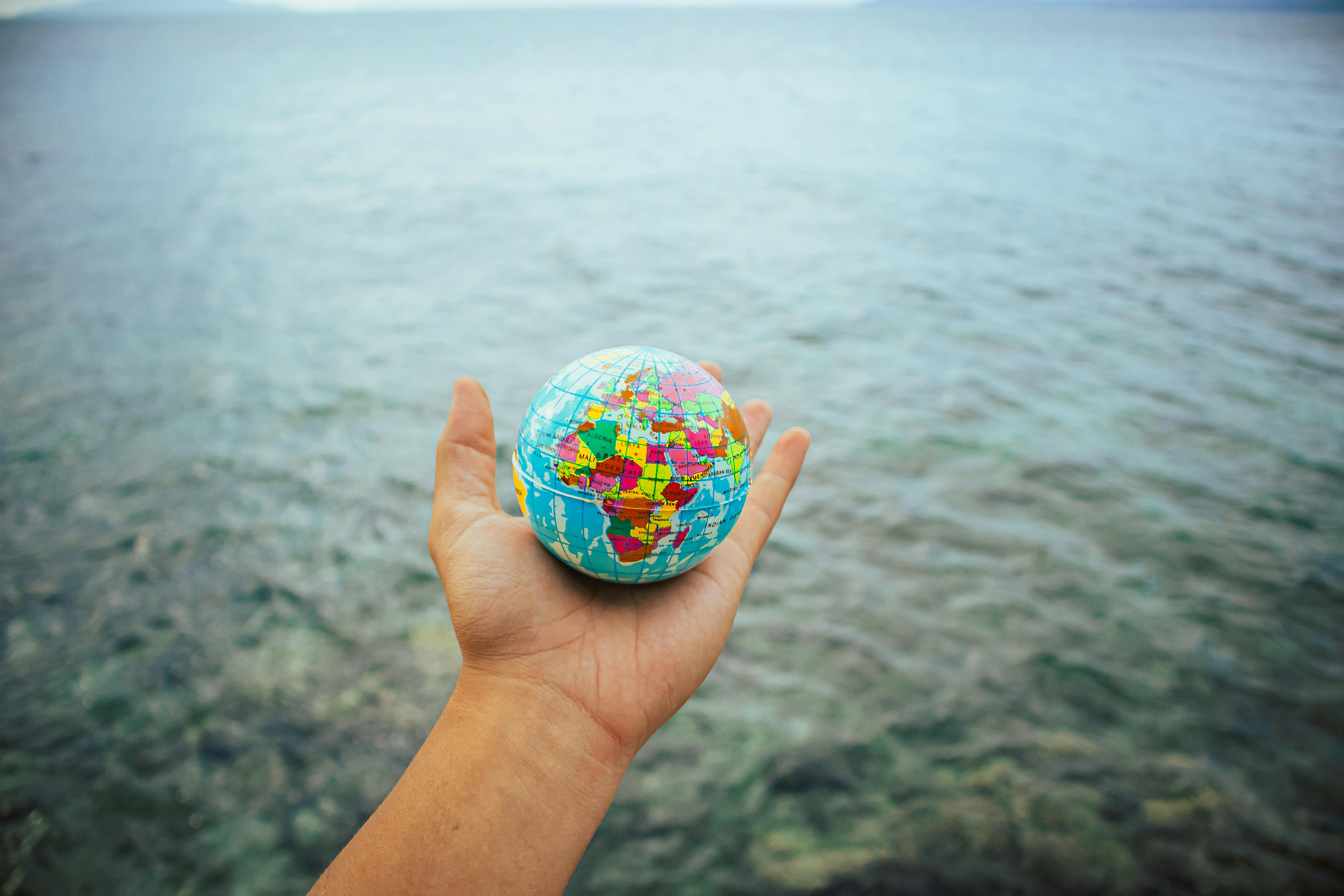 Hand Holding Globe · Free Stock Photo