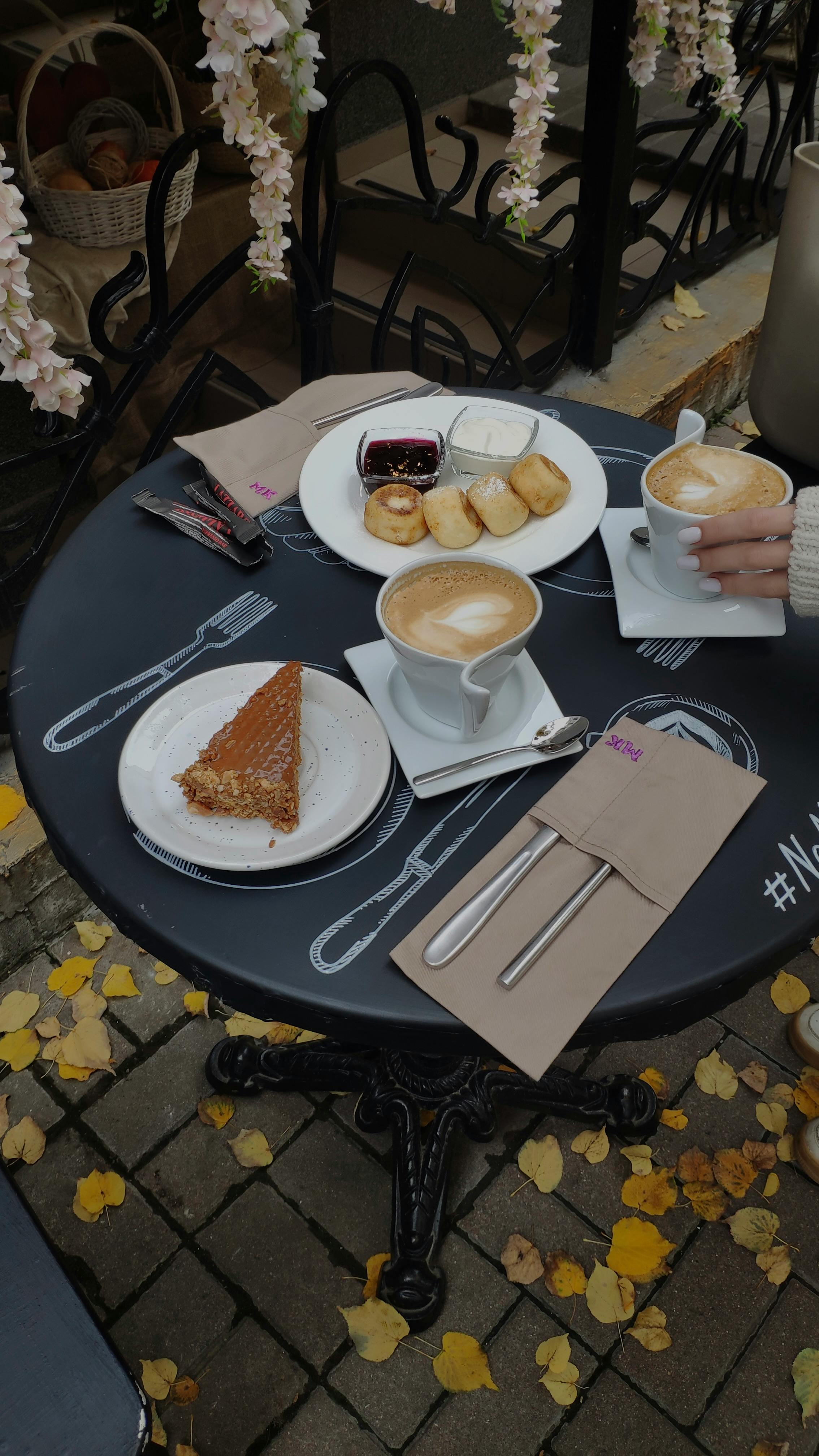 Coffees and Cake on a Table in a Cafe · Free Stock Photo