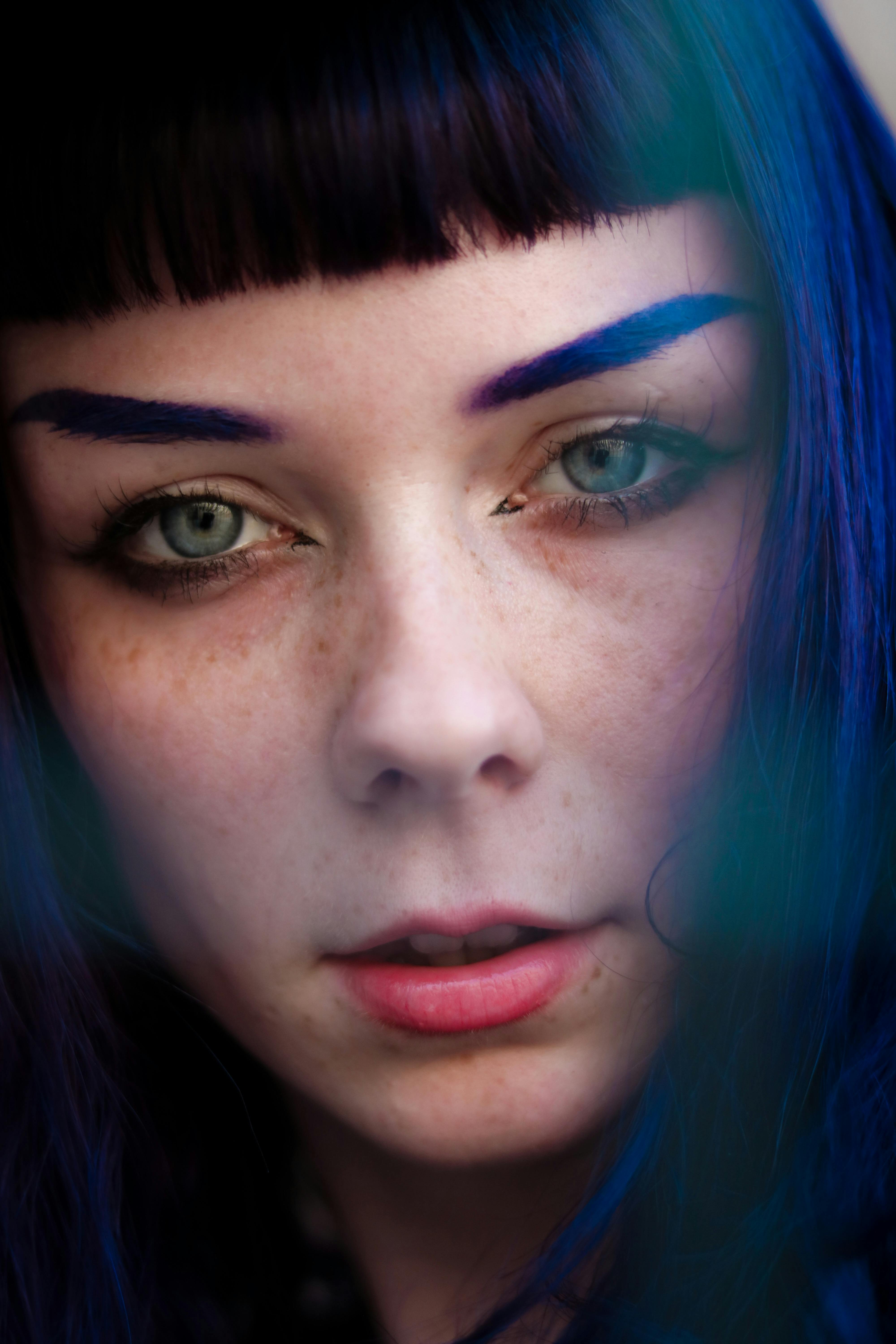 Young Brunette with Bangs Wearing Eyeglasses · Free Stock Photo