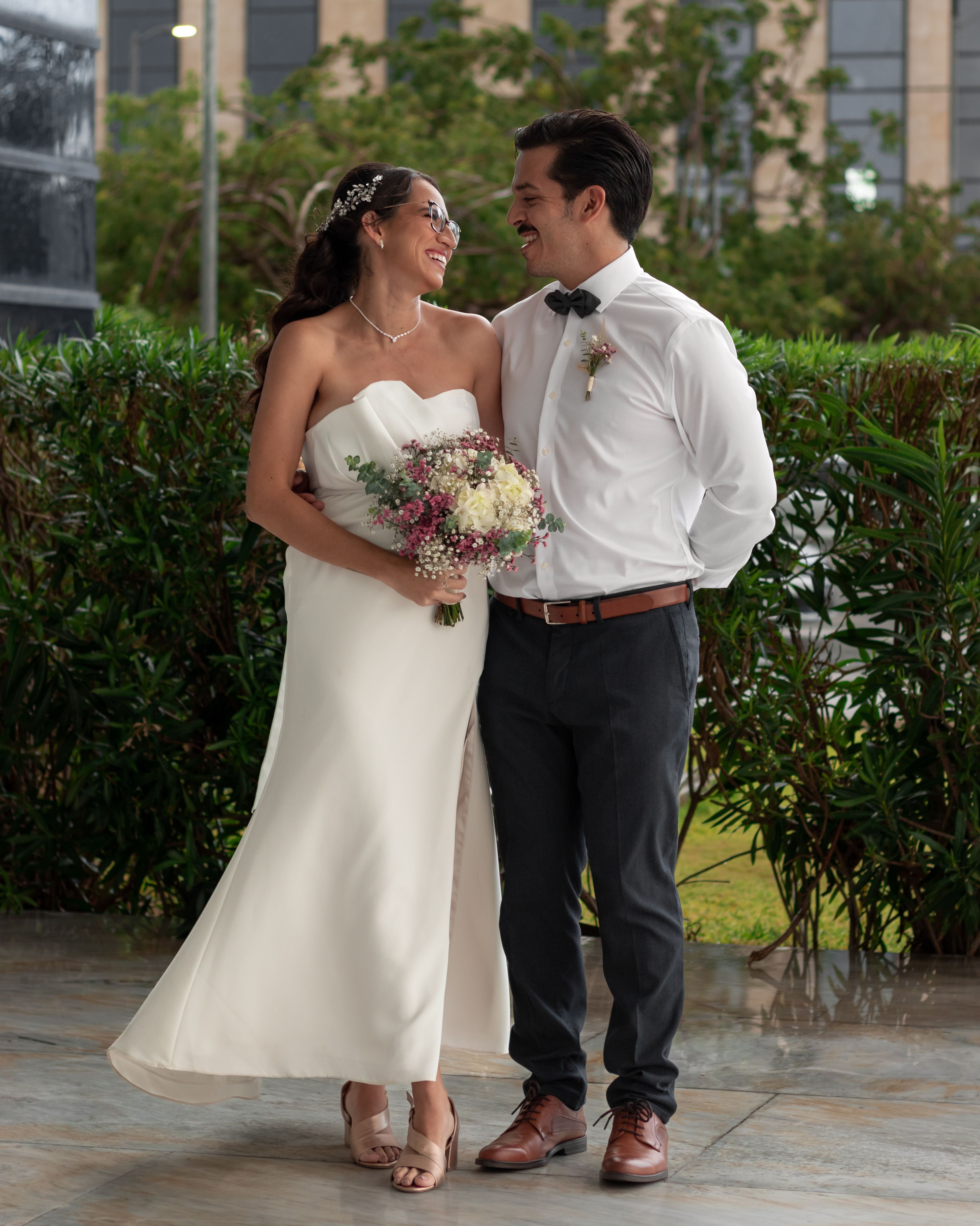 Smiling Newlyweds Standing Together · Free Stock Photo