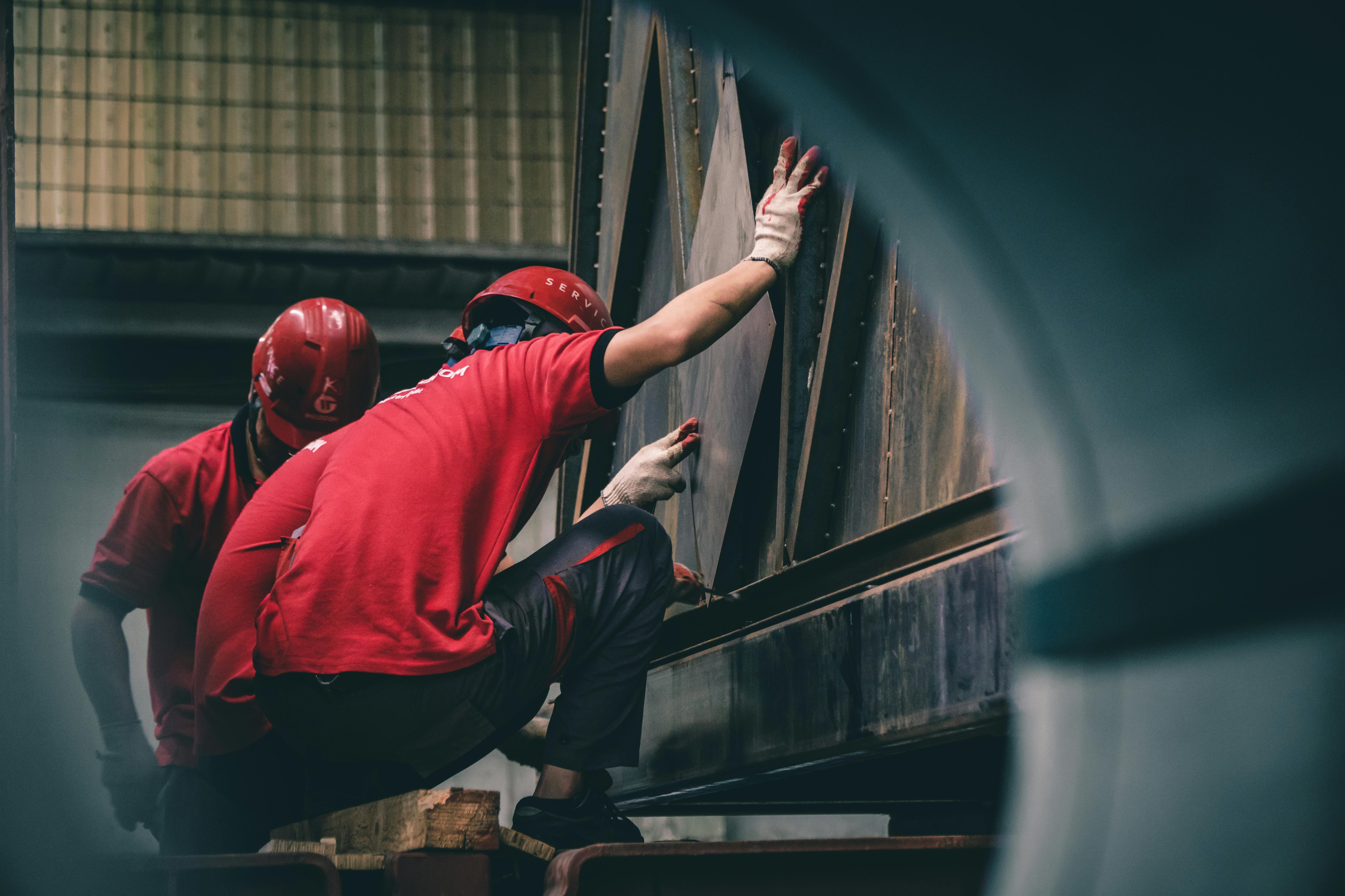 Workers in Red T-Shirts in Factory · Free Stock Photo