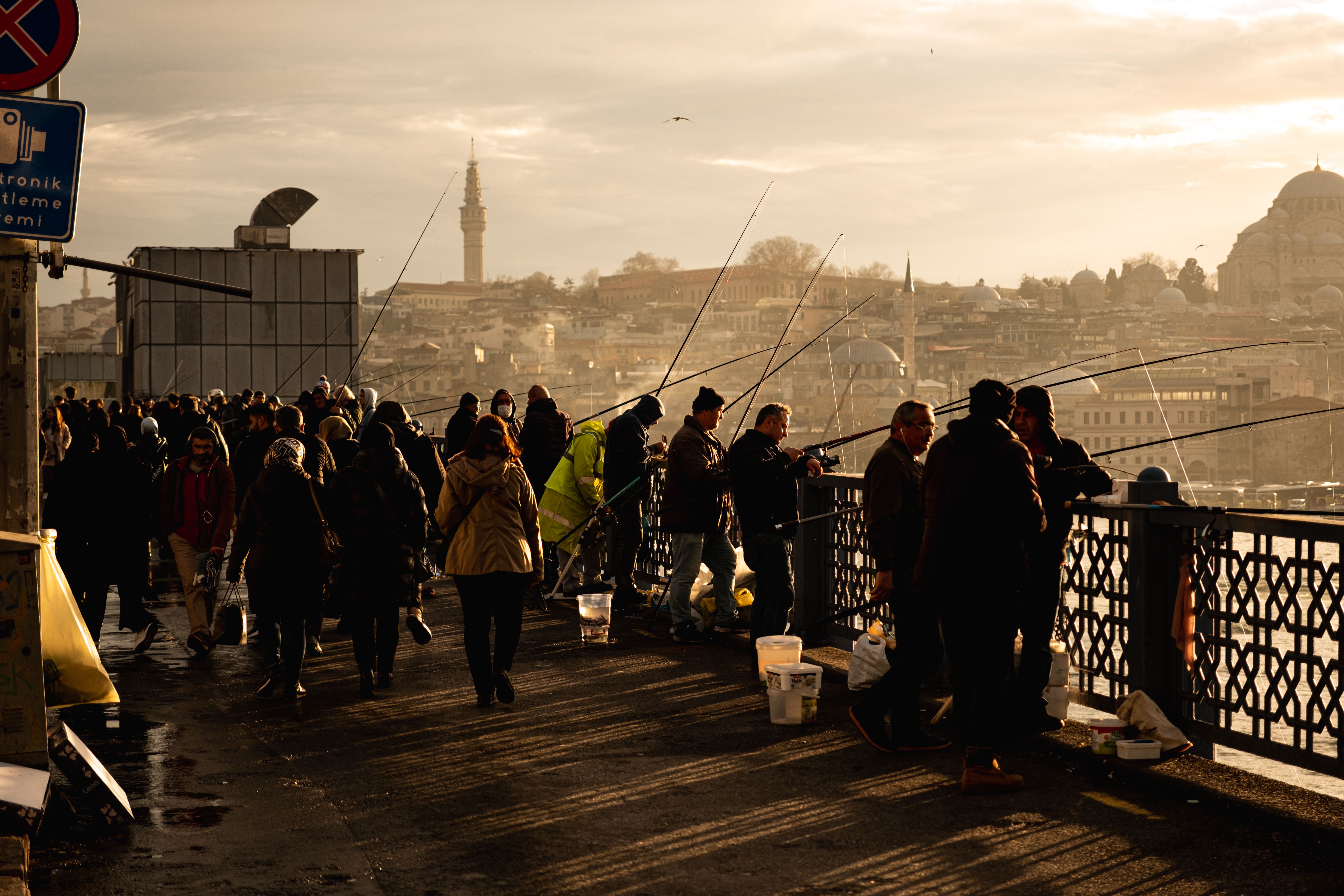 Photo of People Fishing on a Bridge · Free Stock Photo