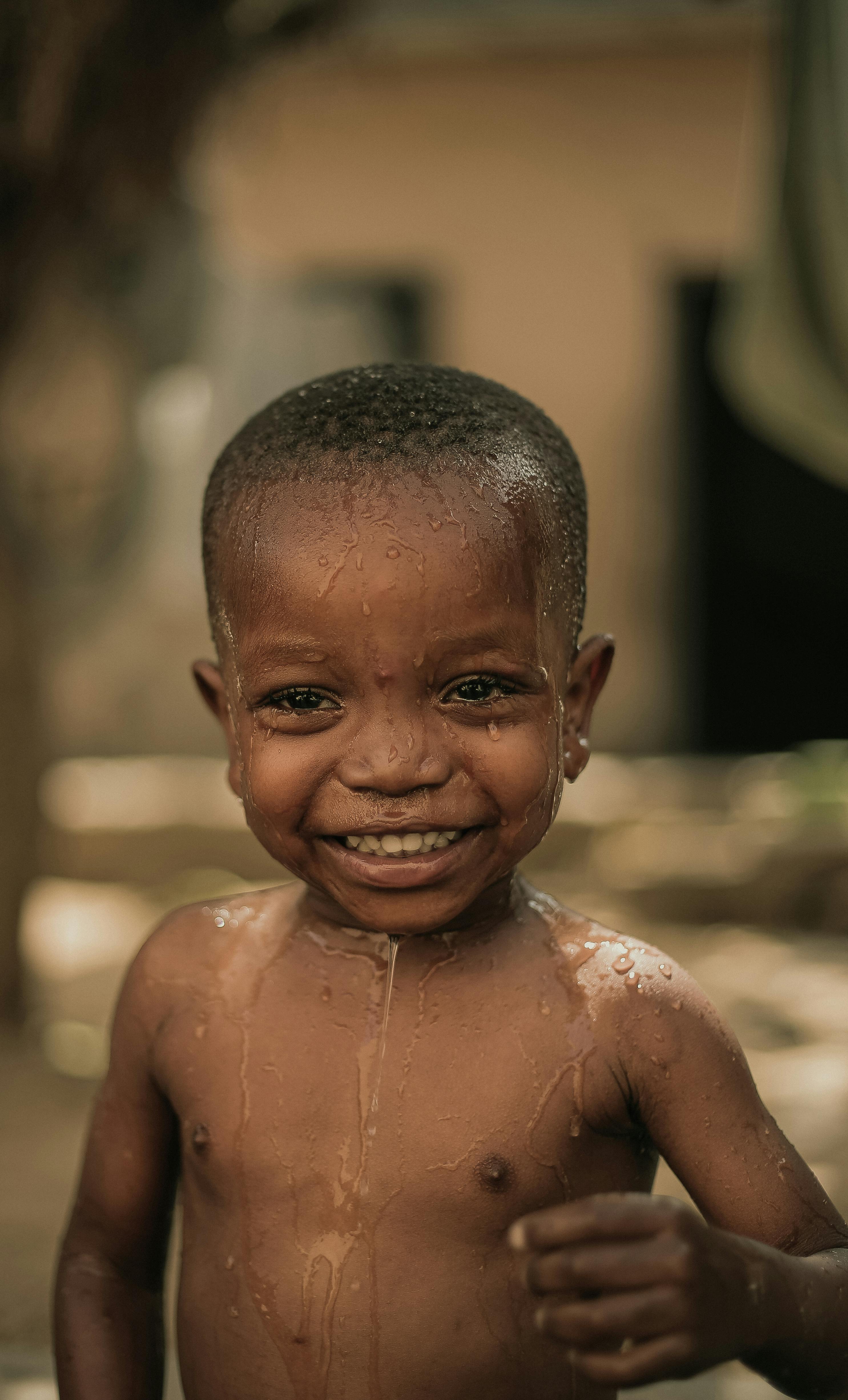 Child Jumping Into Body of Water · Free Stock Photo