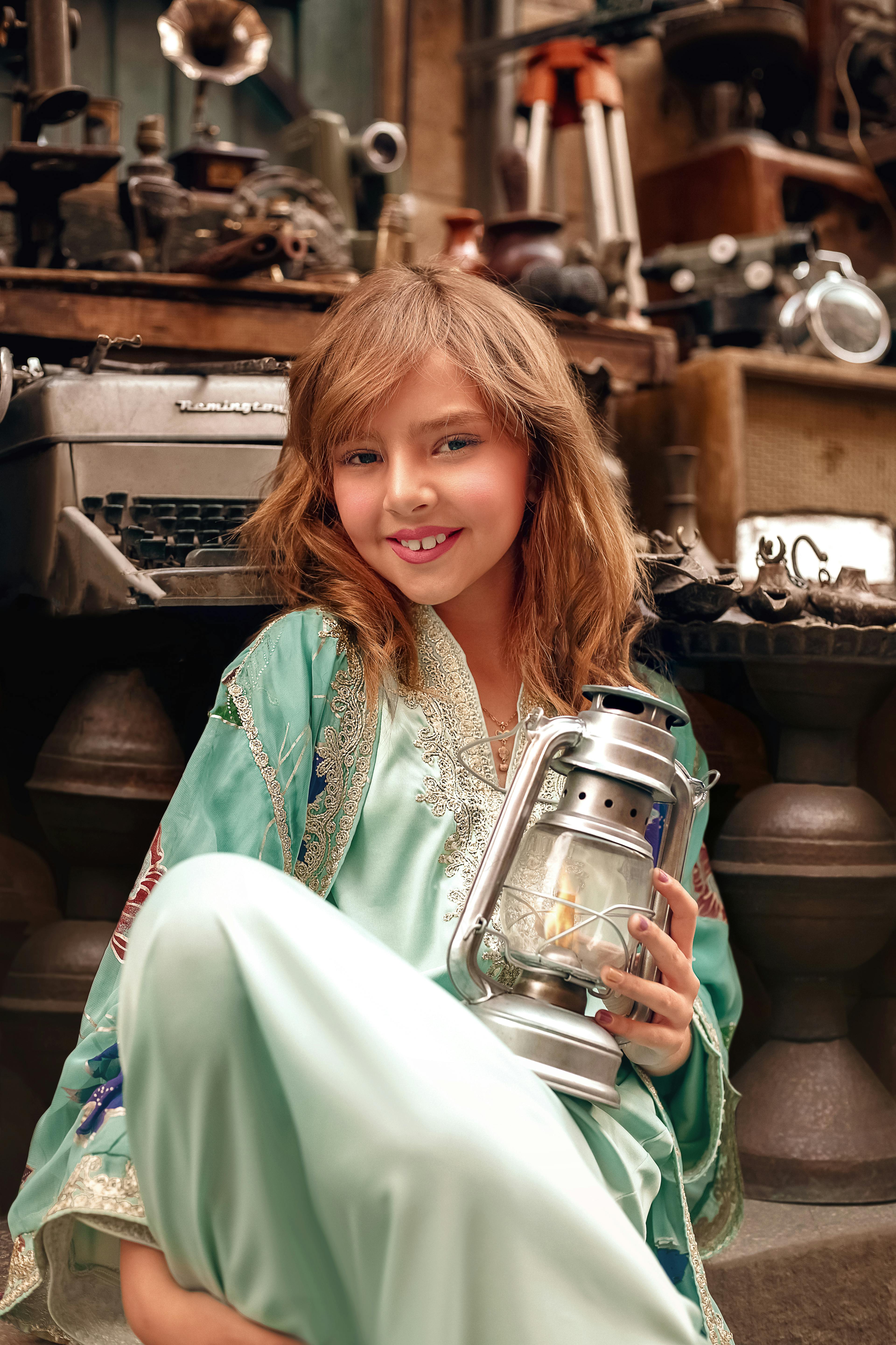 Child Model in Long Blue Dress Holding Vintage Lantern · Free Stock Photo