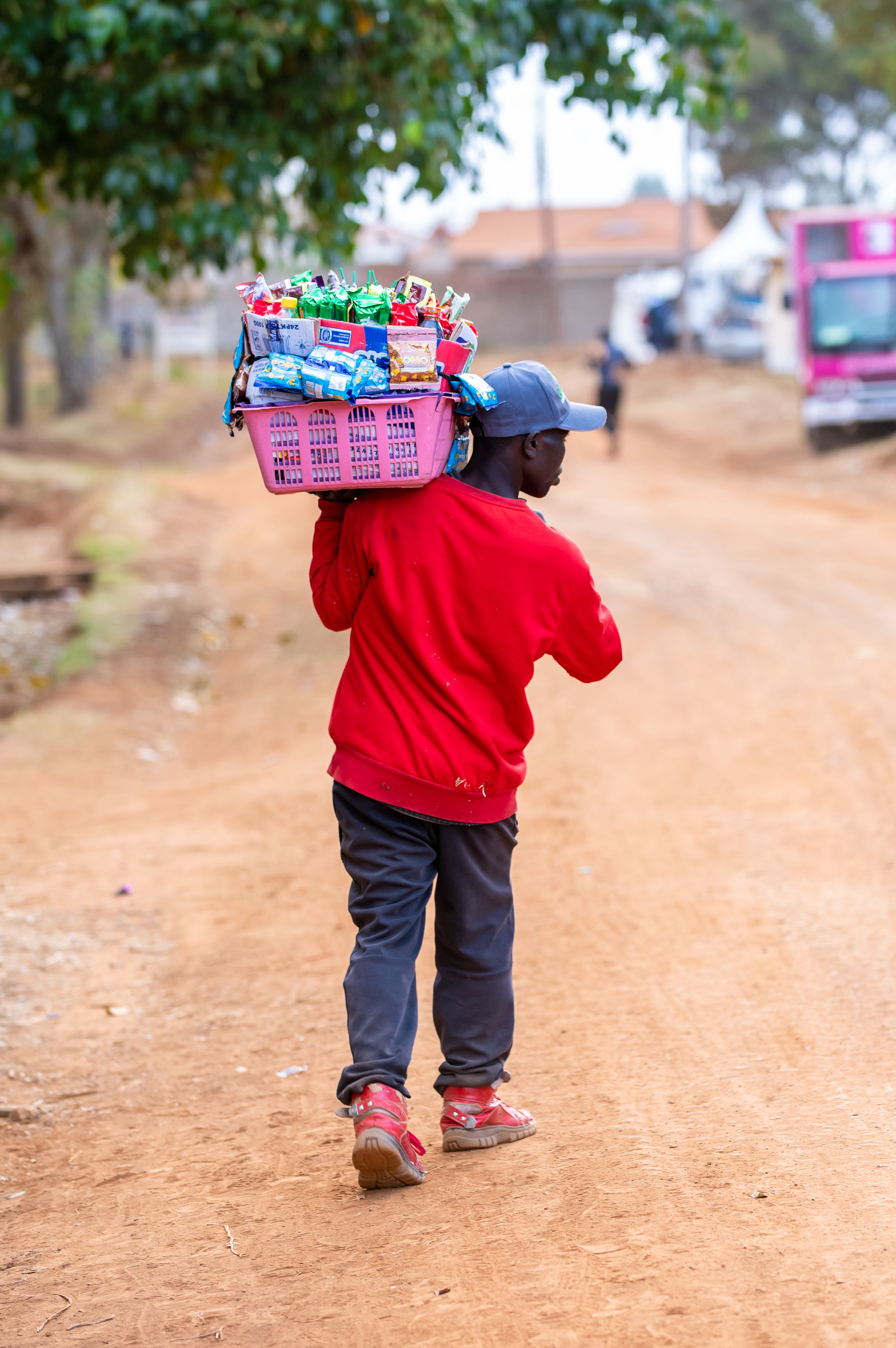 Man Carrying Basket with Merchandise · Free Stock Photo