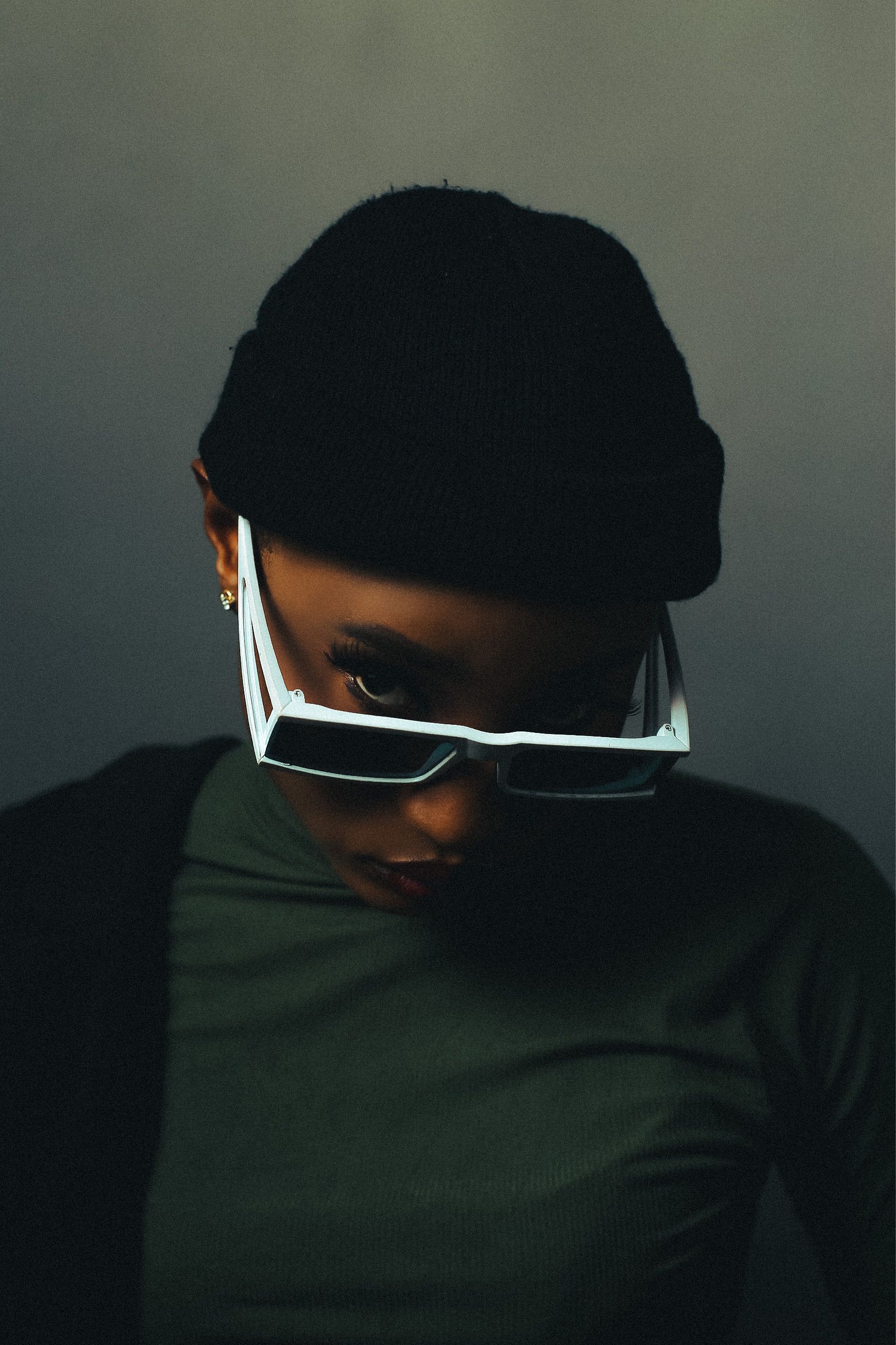 Model Posing in Design Sunglasses · Free Stock Photo