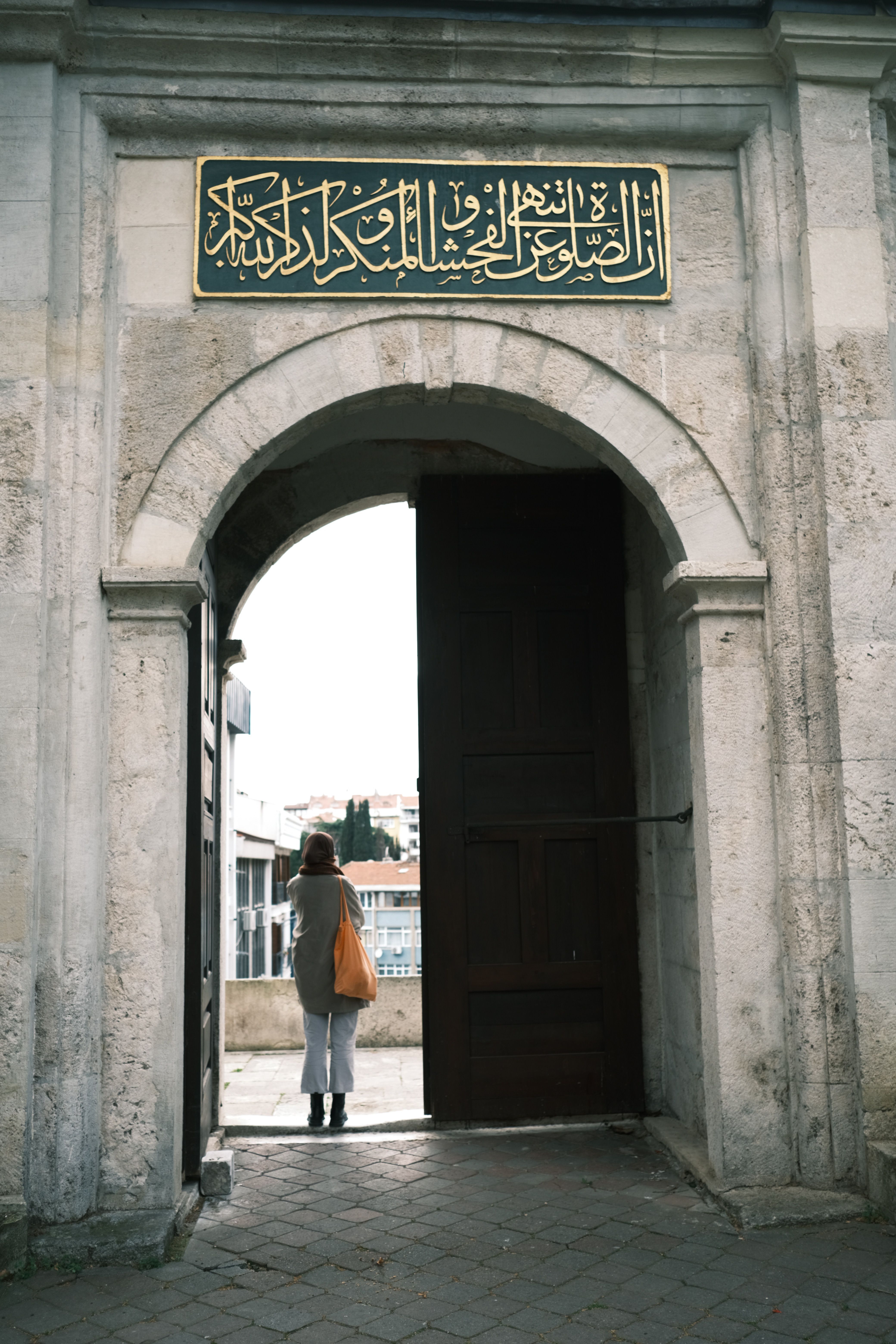 Photo of a Man in Front of an Open Gate · Free Stock Photo